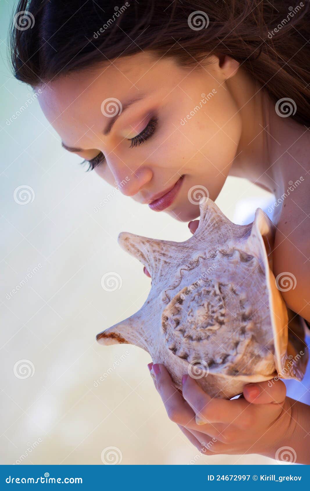 Girl with seashell stock image. Image of female, hand - 24672997