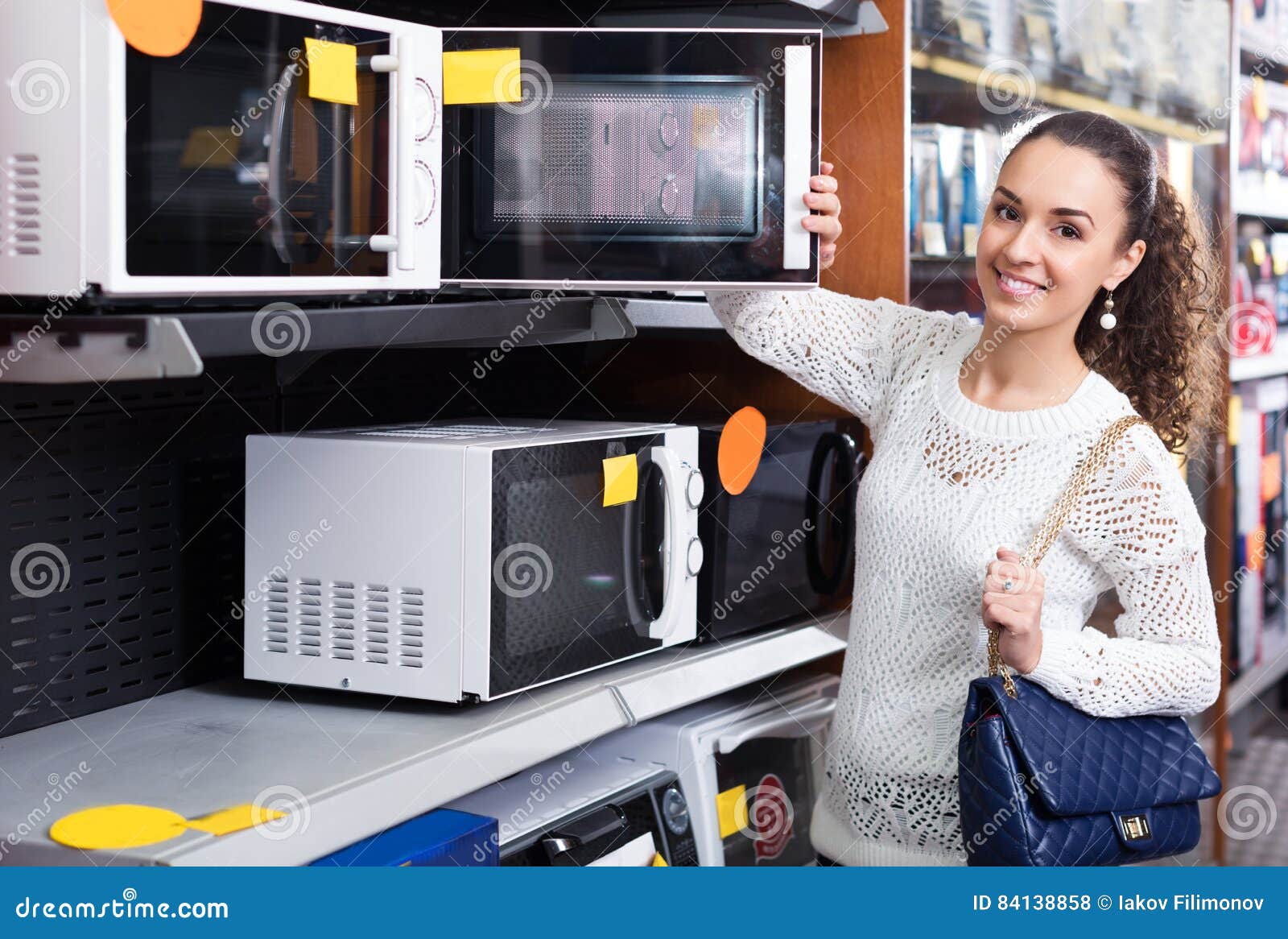 Girl Selecting Microwave Oven Stock Photo - Image of products, people ...