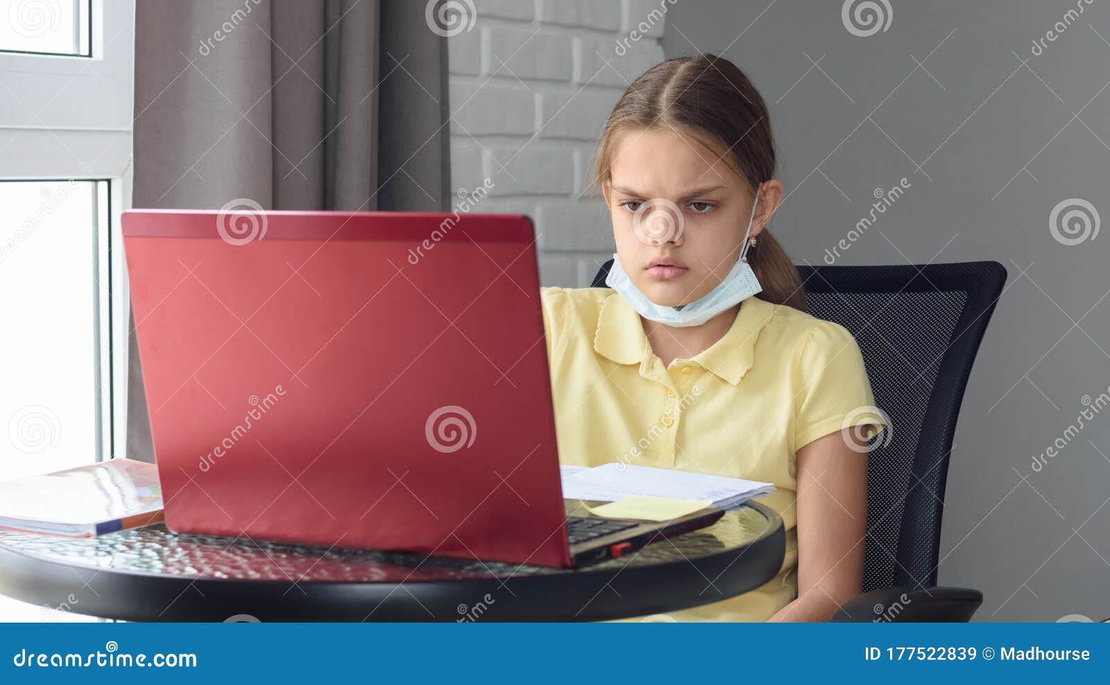 Girl in Self-isolation Mode Sits at a Computer and Does Homework Online ...