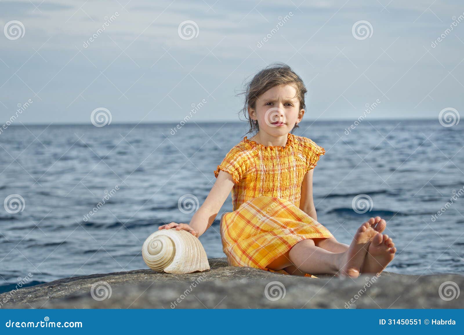 Girl with shell at the sea stock image. Image of outdoor - 31450551