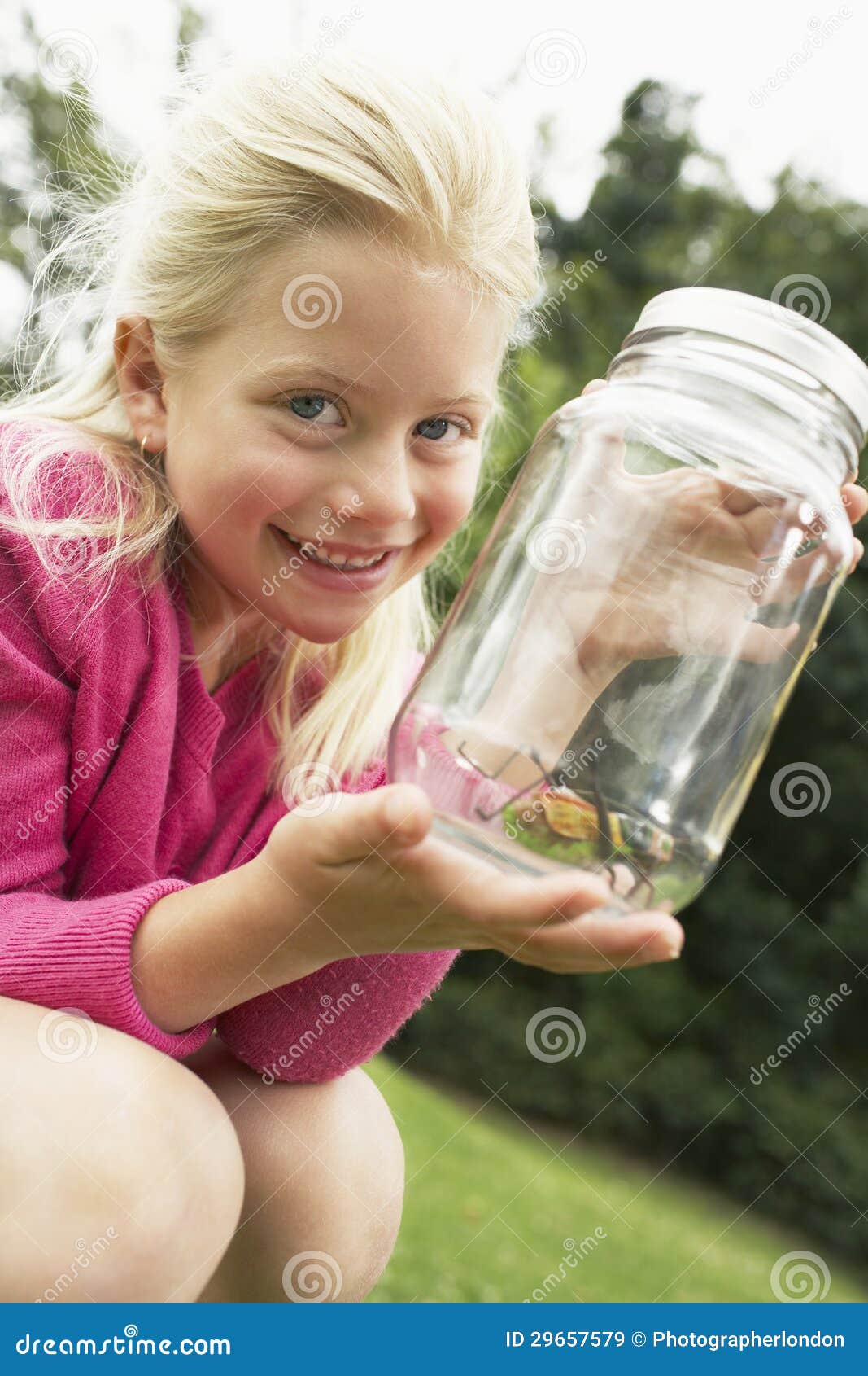 Girl Showing Insect in Jar stock image. Image of children - 29657579
