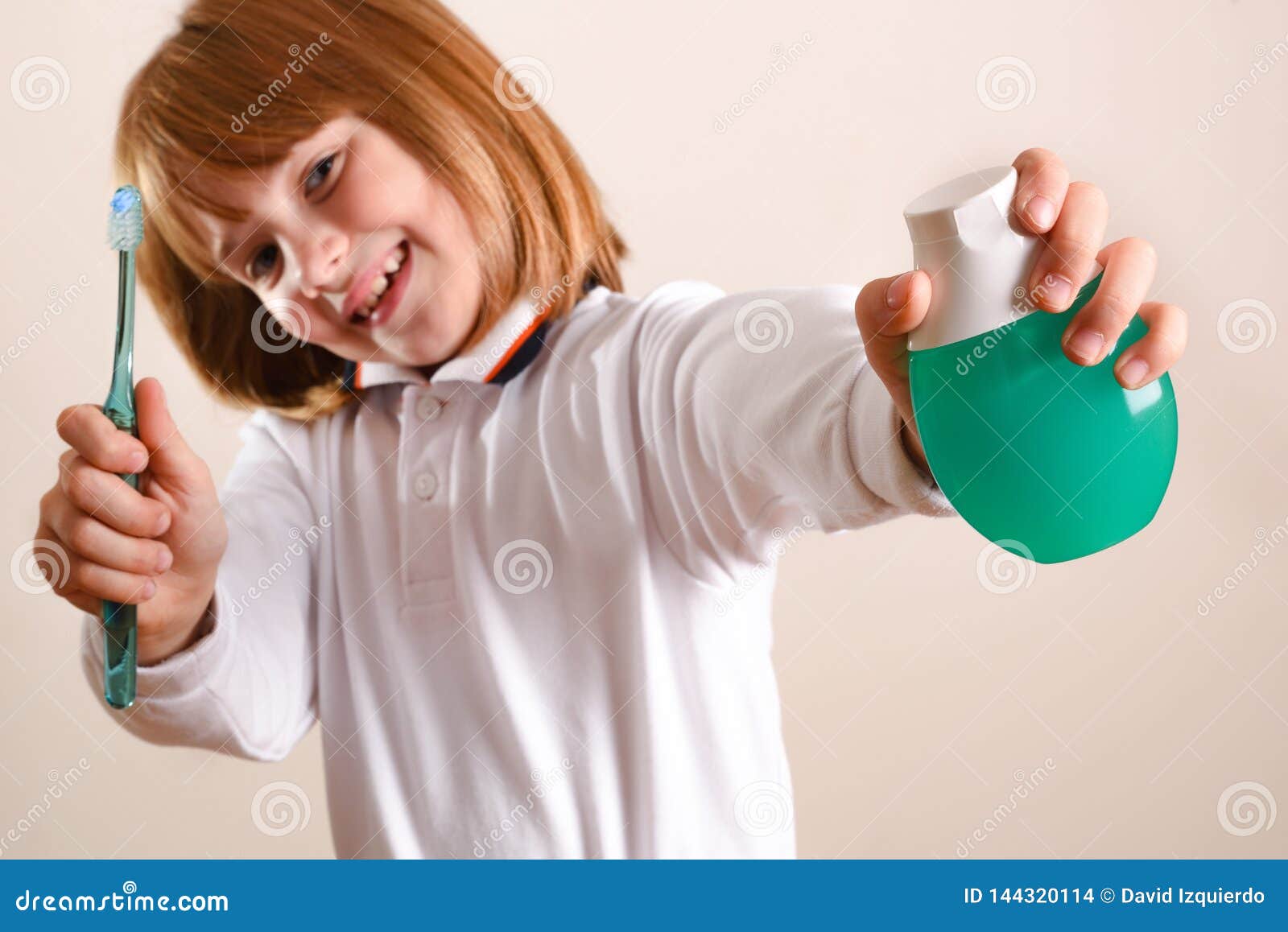 Girl Showing Toothpaste and Toothbrush on Brown Background Isolated ...