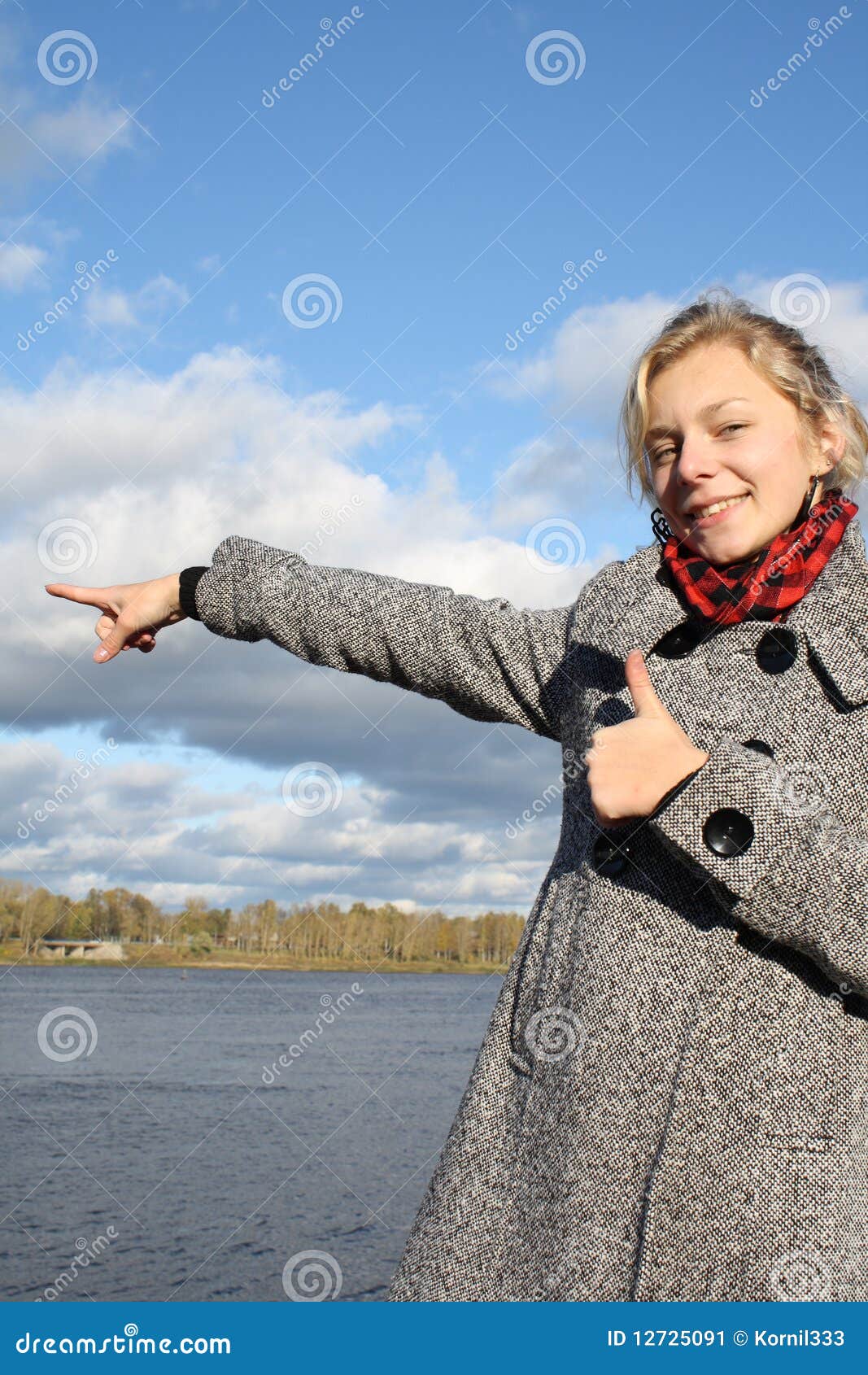 The girl shows a direction stock image. Image of clothes - 12725091