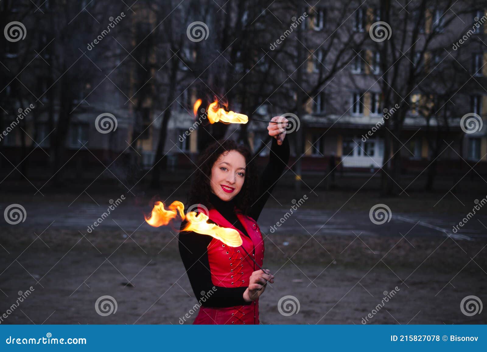 A girl shows a fire show stock photo. Image of party - 215827078