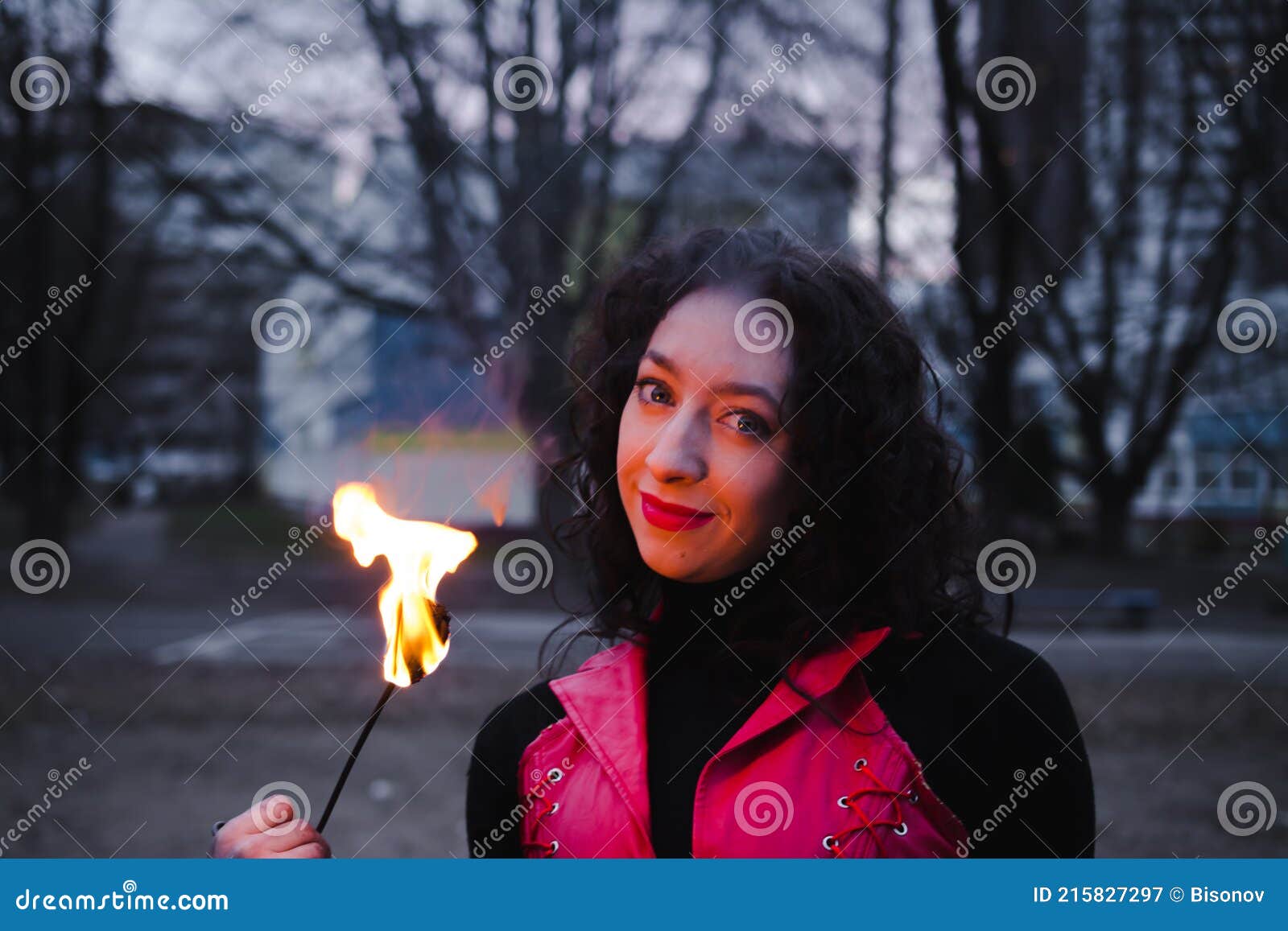 A girl shows a fire show stock image. Image of glowing - 215827297