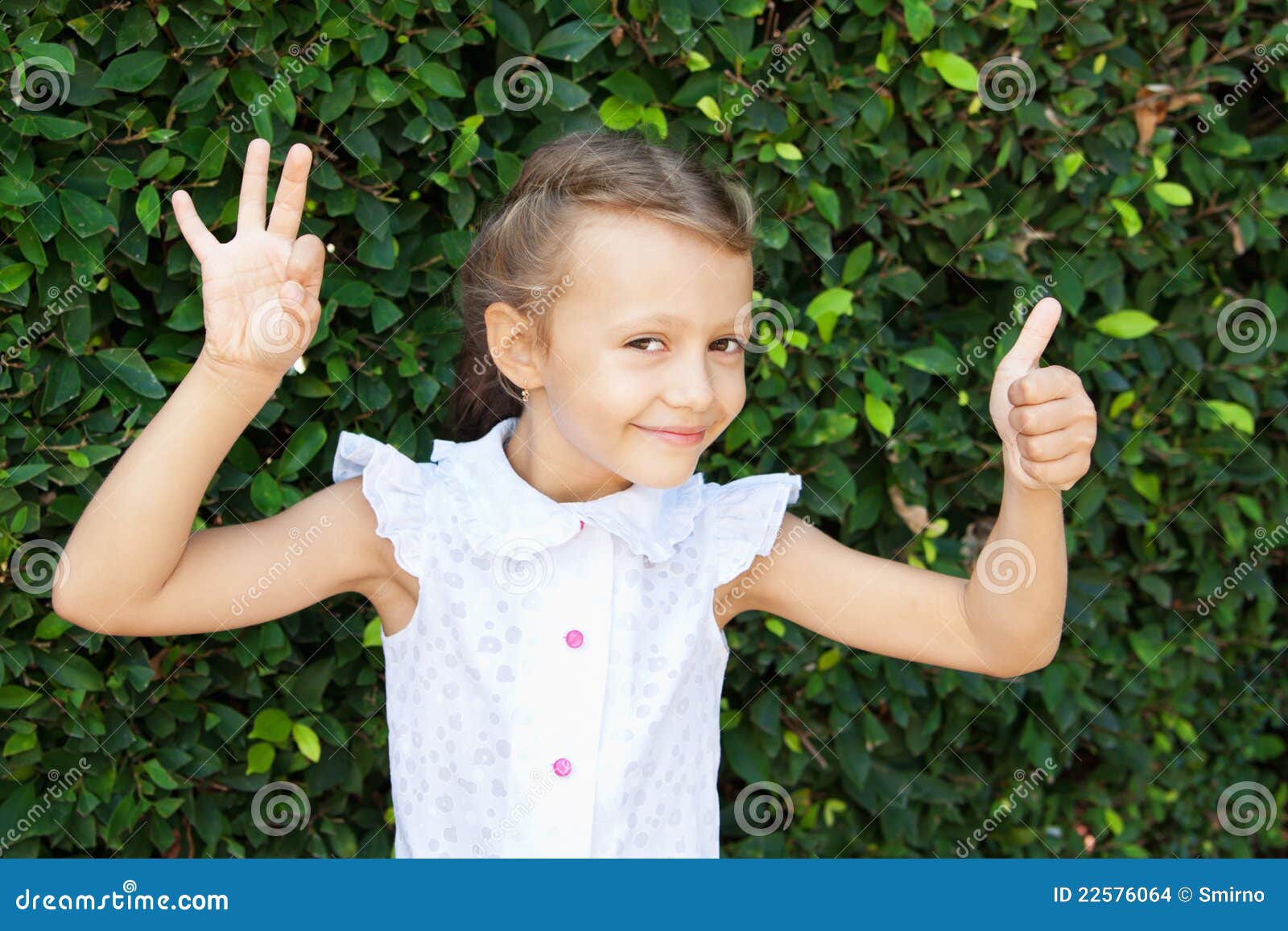 A Girl Shows a Signs of Excellent and OK Stock Photo - Image of leaves ...