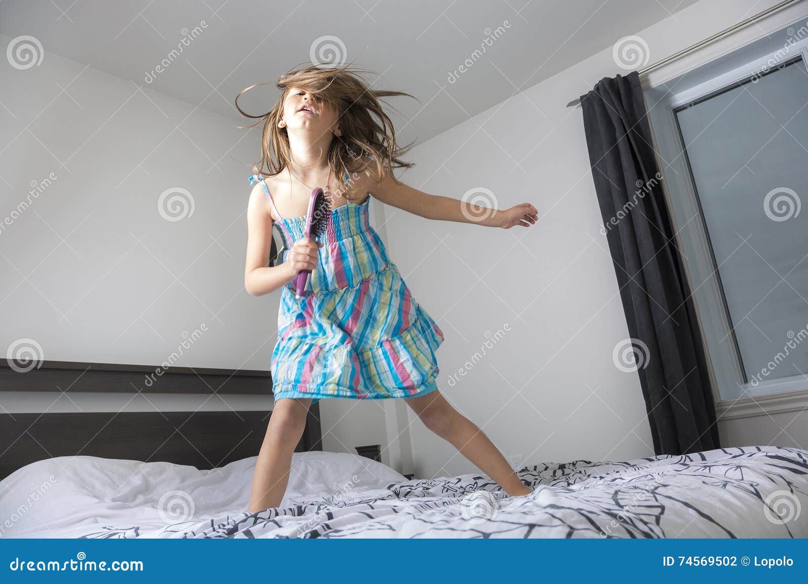 Girl singer in the bedroom stock photo. Image of comb - 74569502