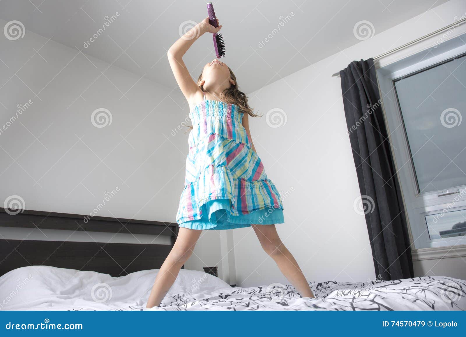Girl singer in the bedroom stock image. Image of girl - 74570479