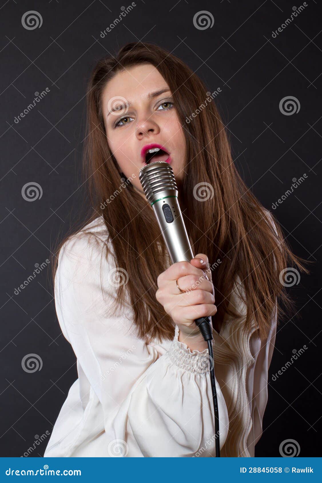 Girl Singing Into A Microphone Stock Photo - Image of people, playing ...