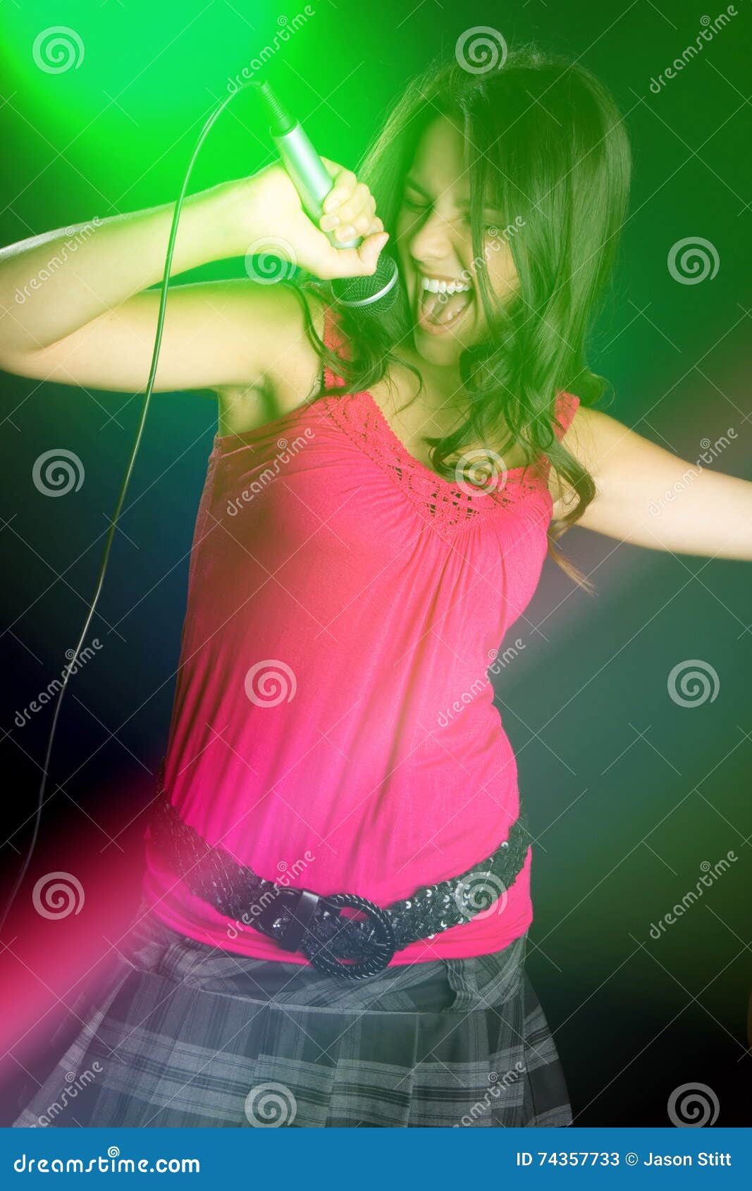 Girl Singing into Microphone Stock Image - Image of background ...