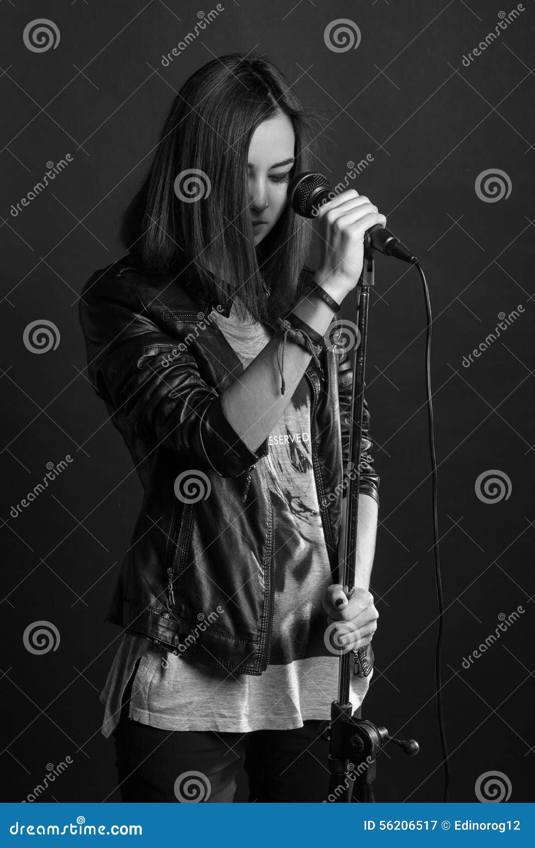 Girl Singing into a Microphone in a Studio Stock Image - Image of ...