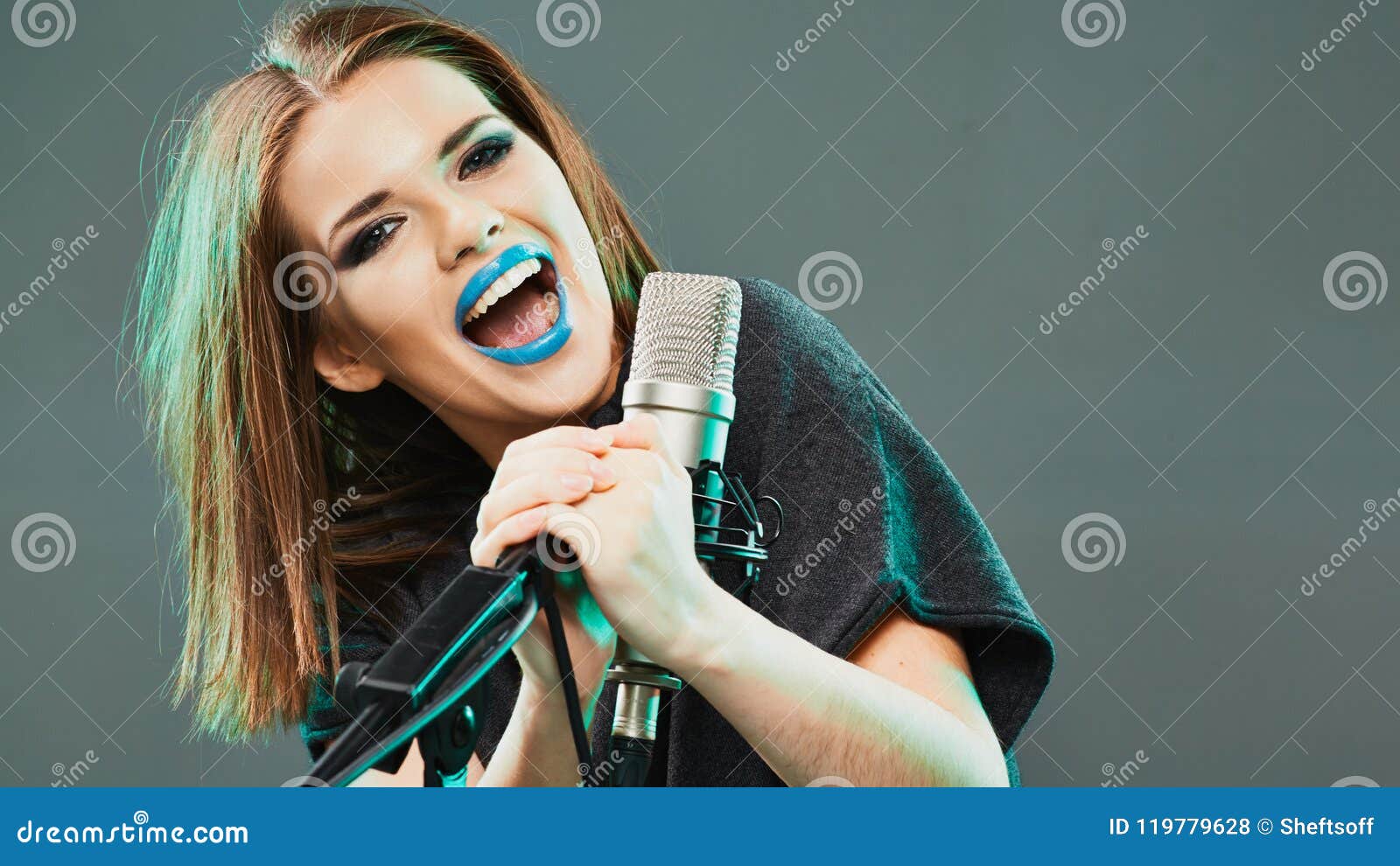 Girl Singing into a Microphone. Stock Photo - Image of microphone ...