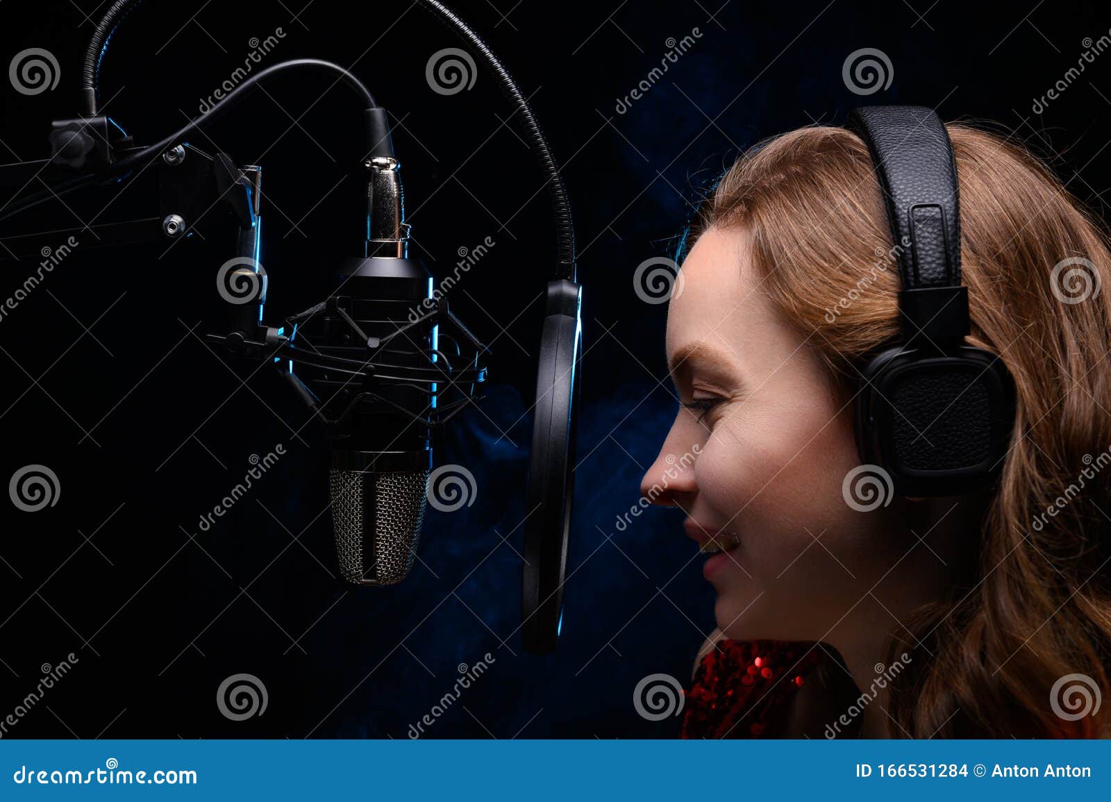 Girl Singing in a Studio Microphone in a Recording Studio Stock Photo ...