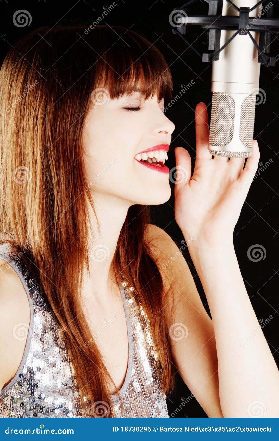 Girl Singing To the Microphone in a Studio Stock Photo - Image of music ...