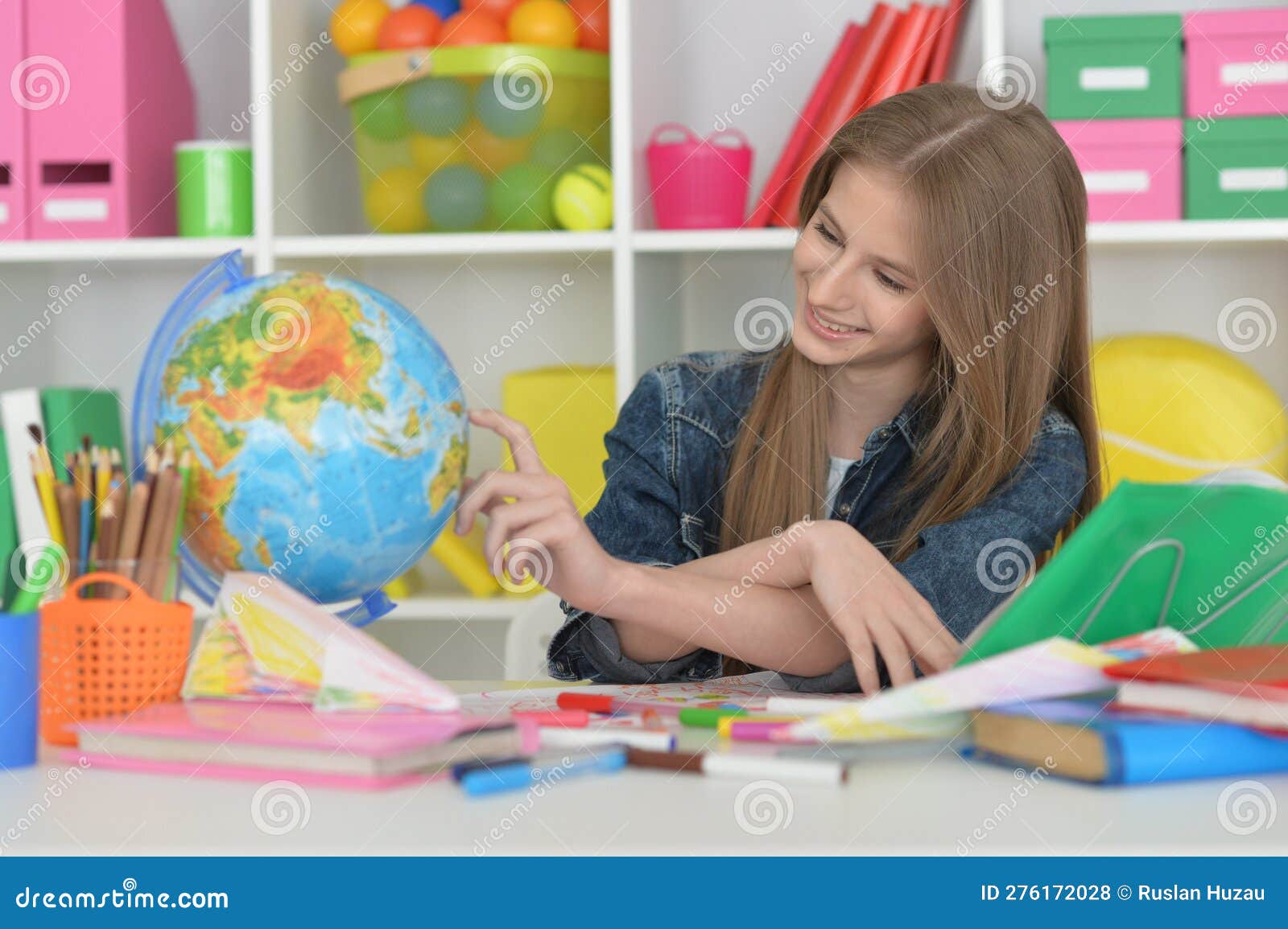 Girl Siting at Table with Globe and Studying Stock Photo - Image of ...