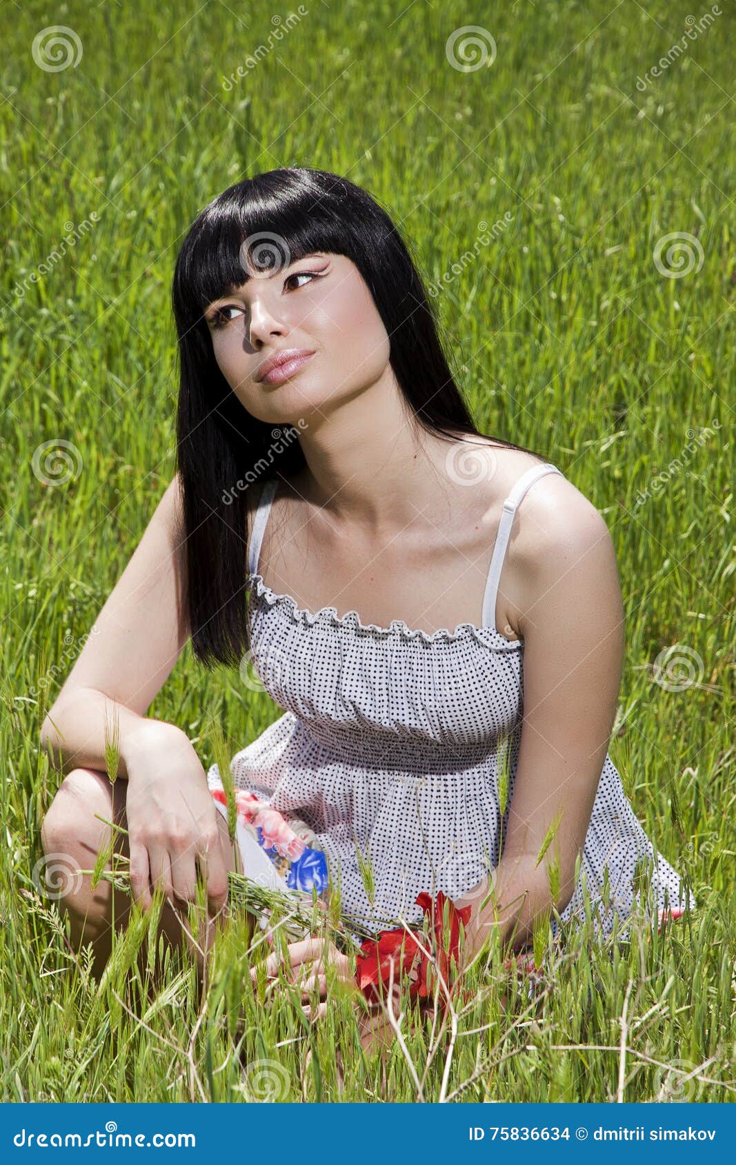 Girl Sits in a Field of Grass Stock Photo - Image of beautiful ...