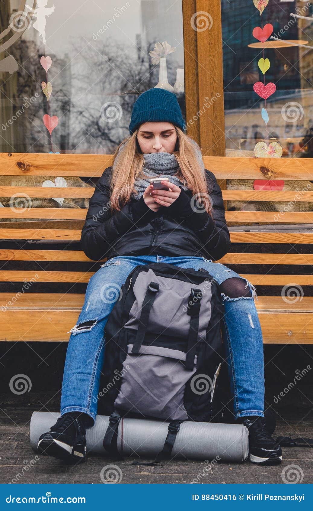 Girl Sitting on a Banch and Using a Phone Stock Photo - Image of ...