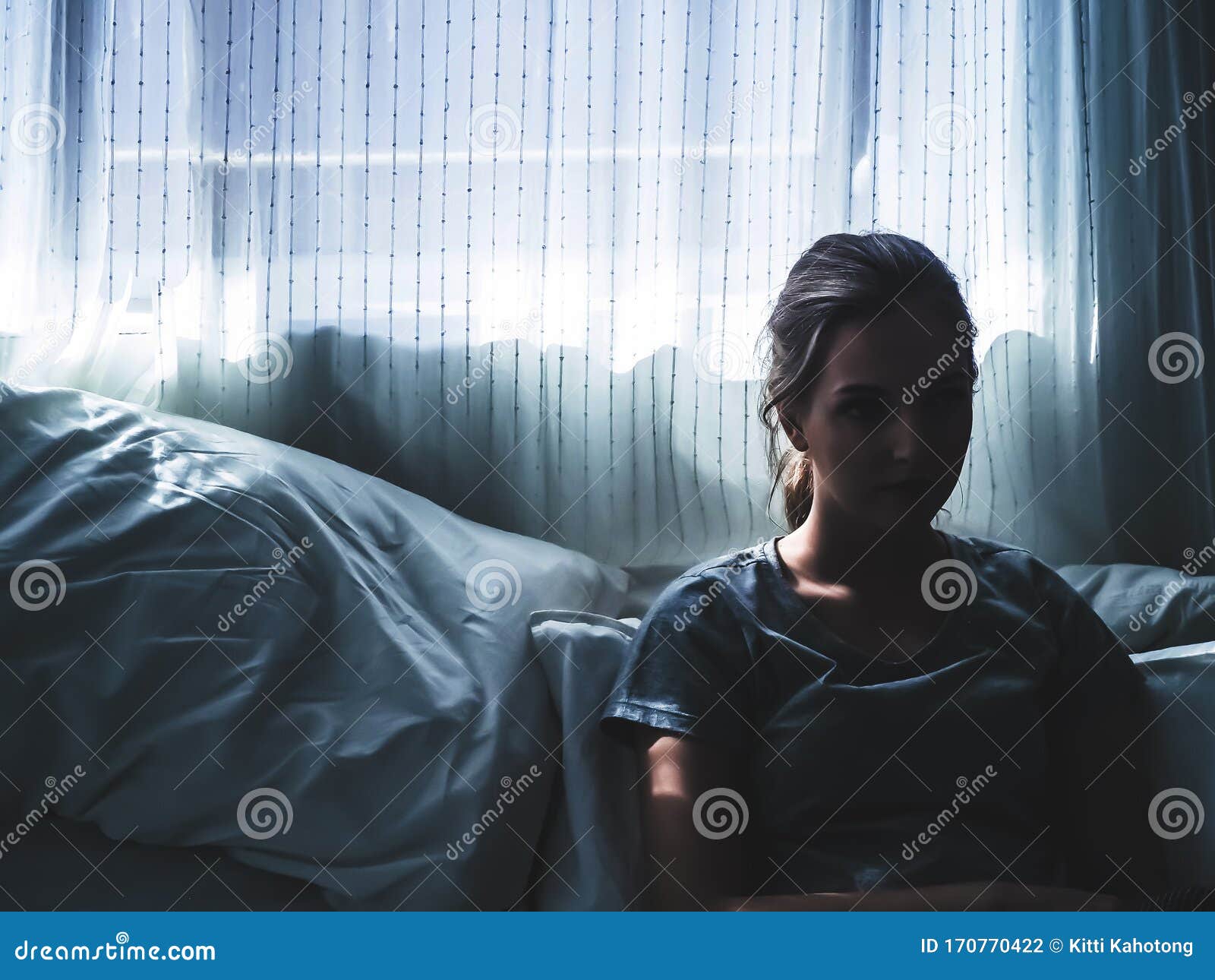 A Girl Sitting in the Bedroom she is Sad Stock Photo - Image of woman ...