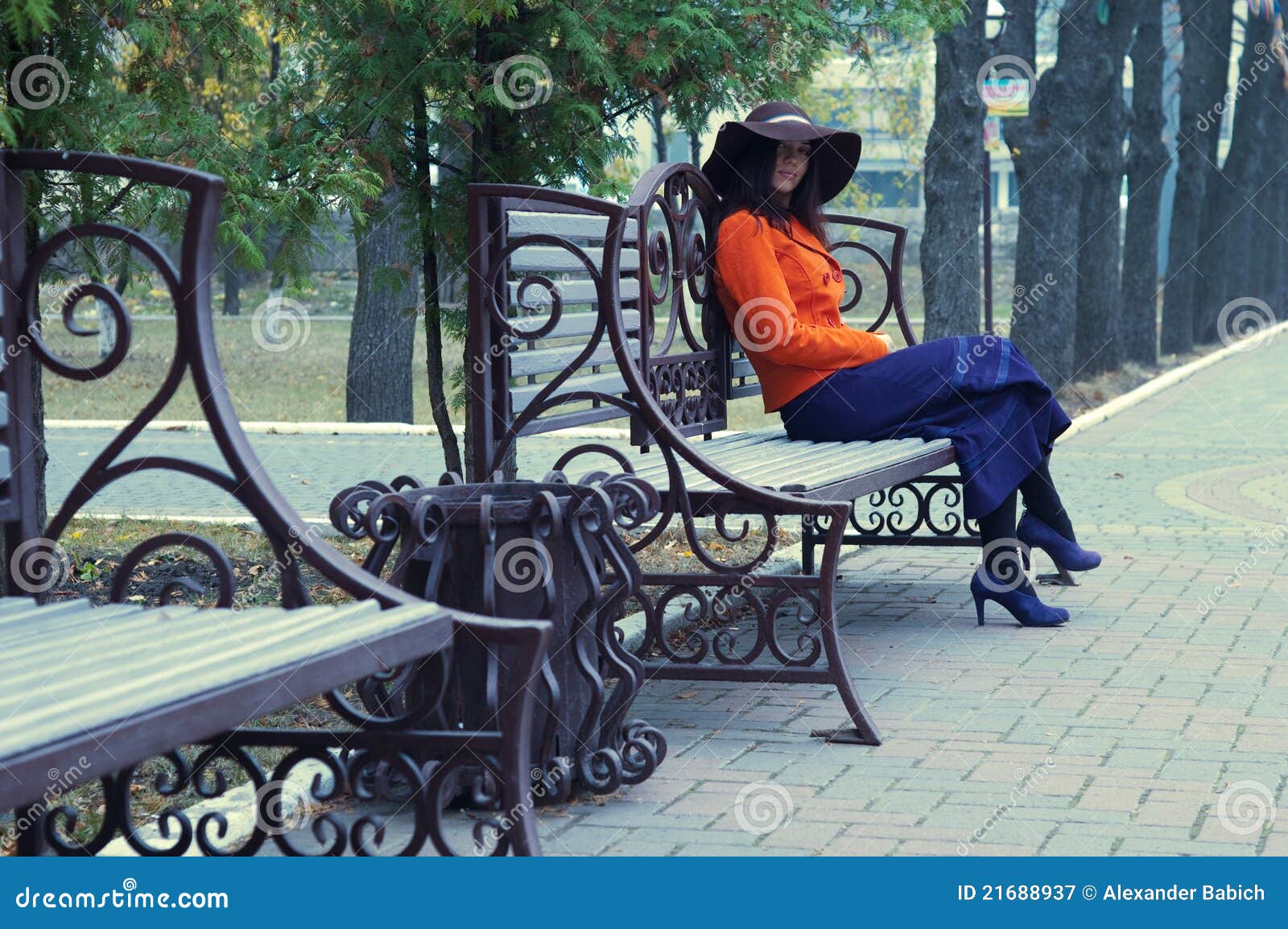 Girl sitting on bench stock image. Image of coat, gaudy - 21688937