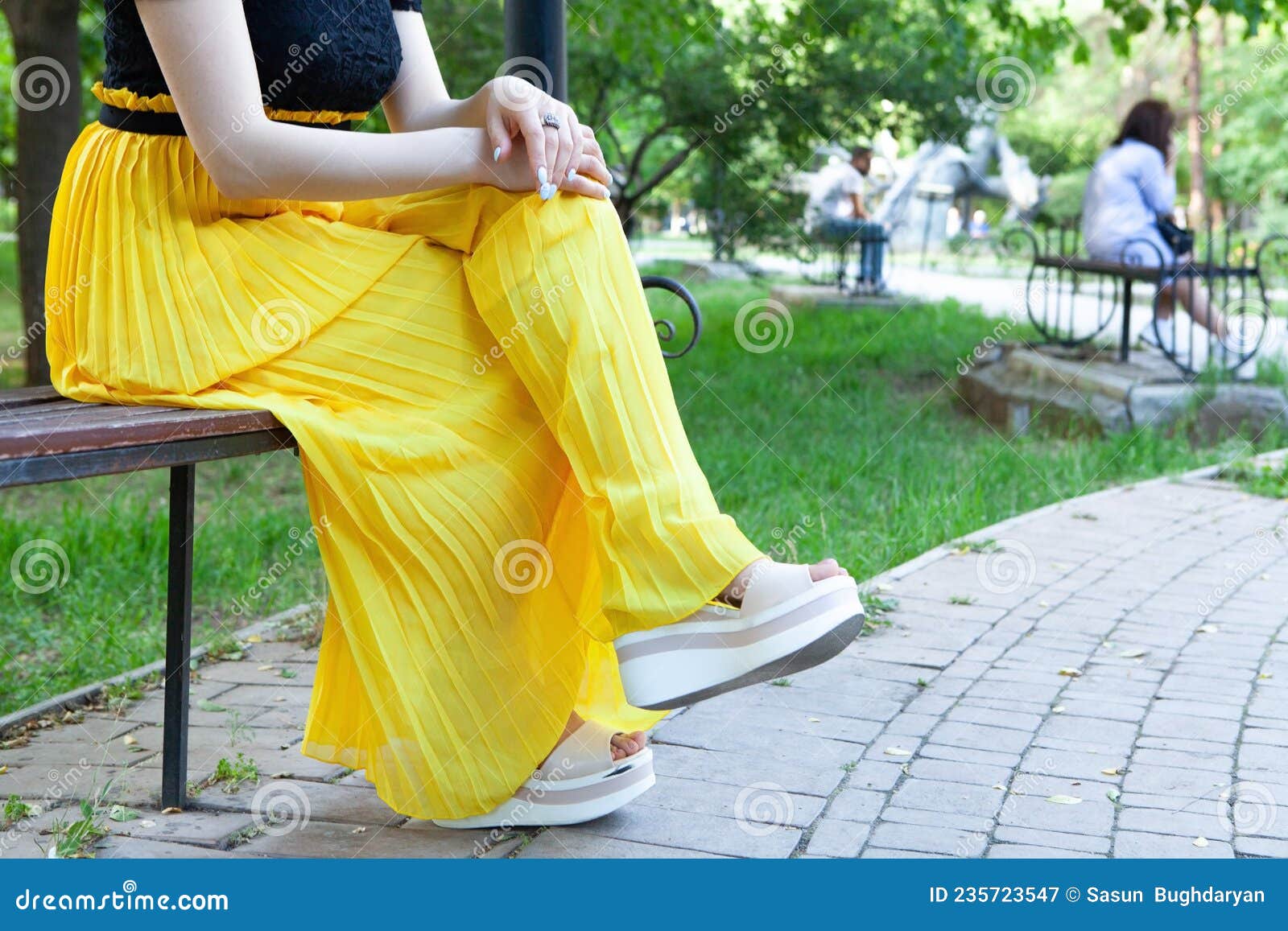 Girl sitting on a bench stock image. Image of summer - 235723547
