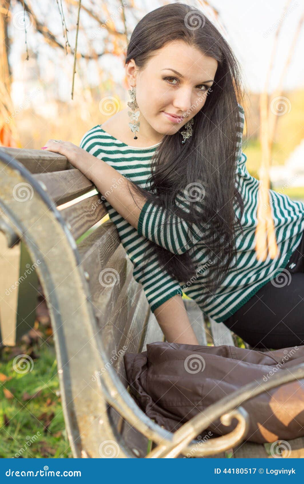 Girl Sitting on Bench Outdoors Stock Image - Image of beautiful, field ...