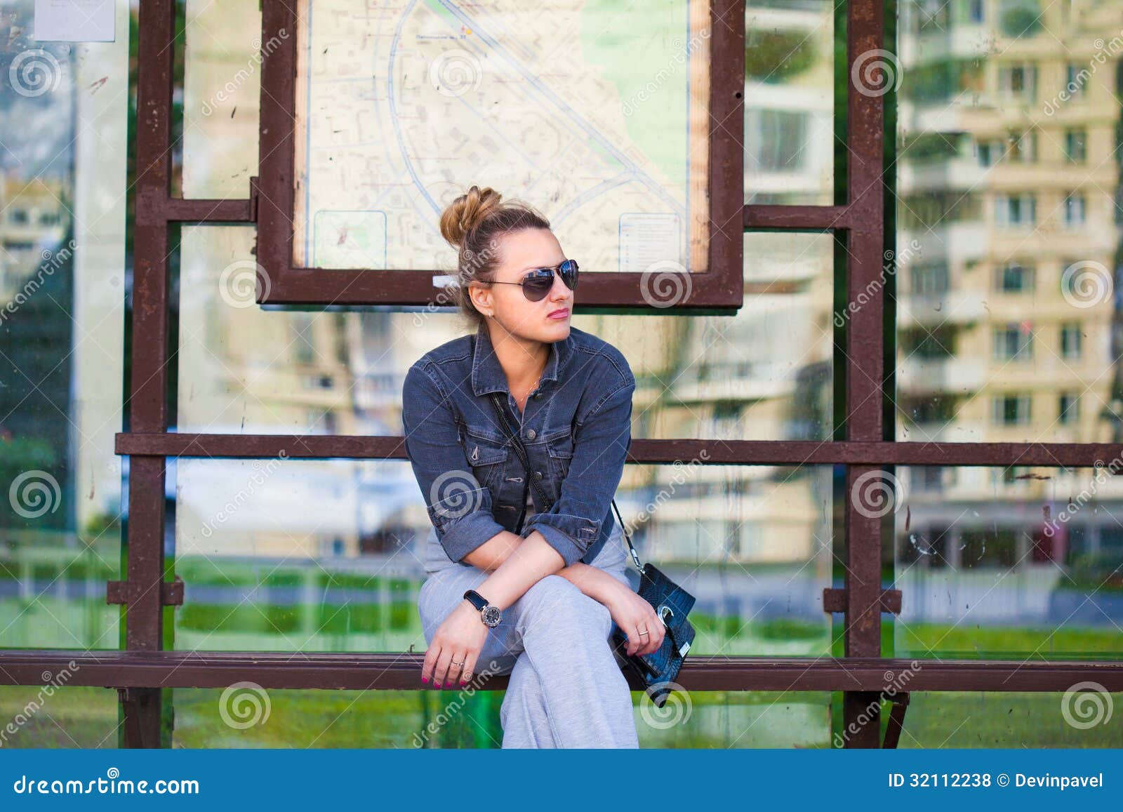 Girl Sitting on a Bus Stop Bench Stock Photo - Image of outdoors ...