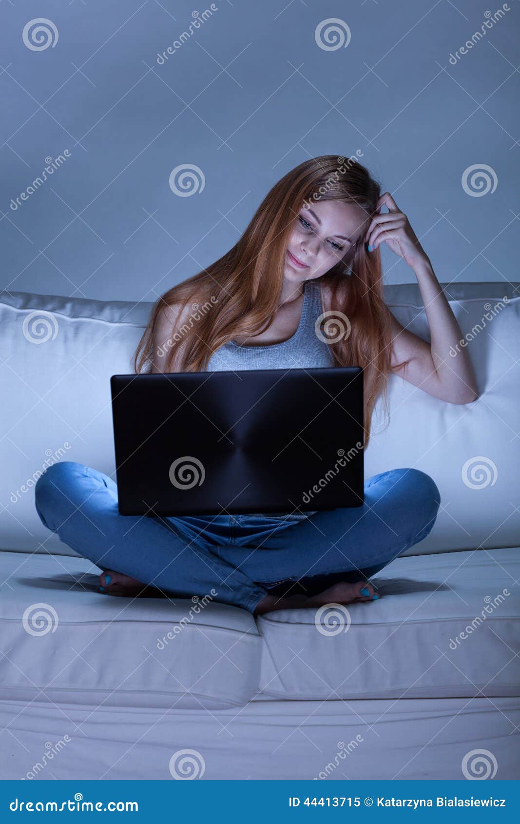 Girl Sitting on Couch and Using Computer Stock Image - Image of evening ...