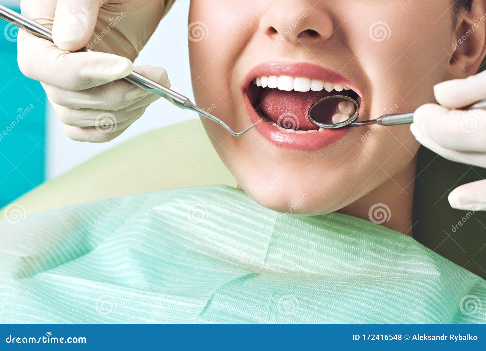 Girl Sitting At Dental Chair With Open Mouth During Oral Check Up While Doctor Visiting Dentist