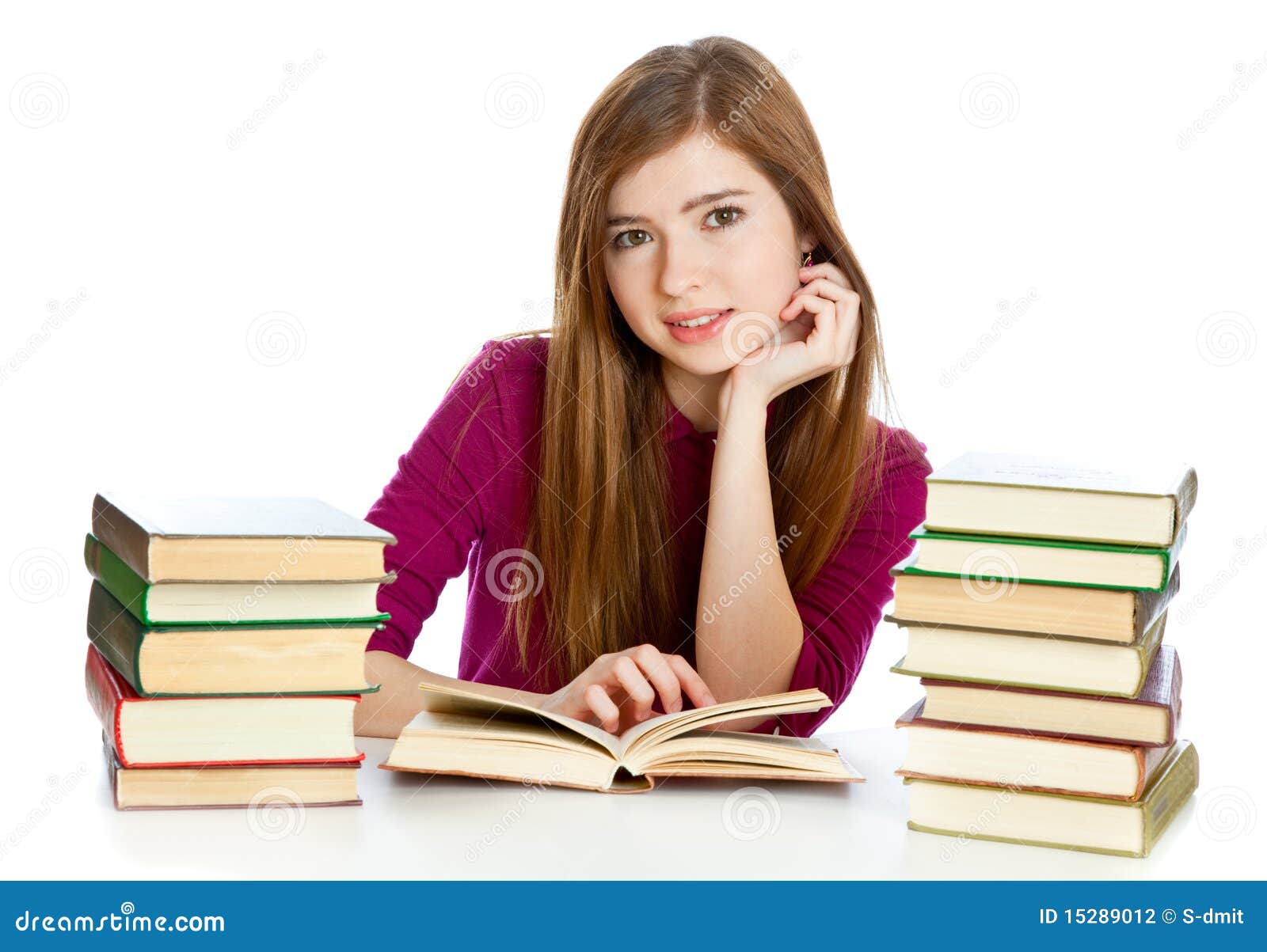 Girl Sitting At The Desk And Reading Book Stock Photography - Image ...