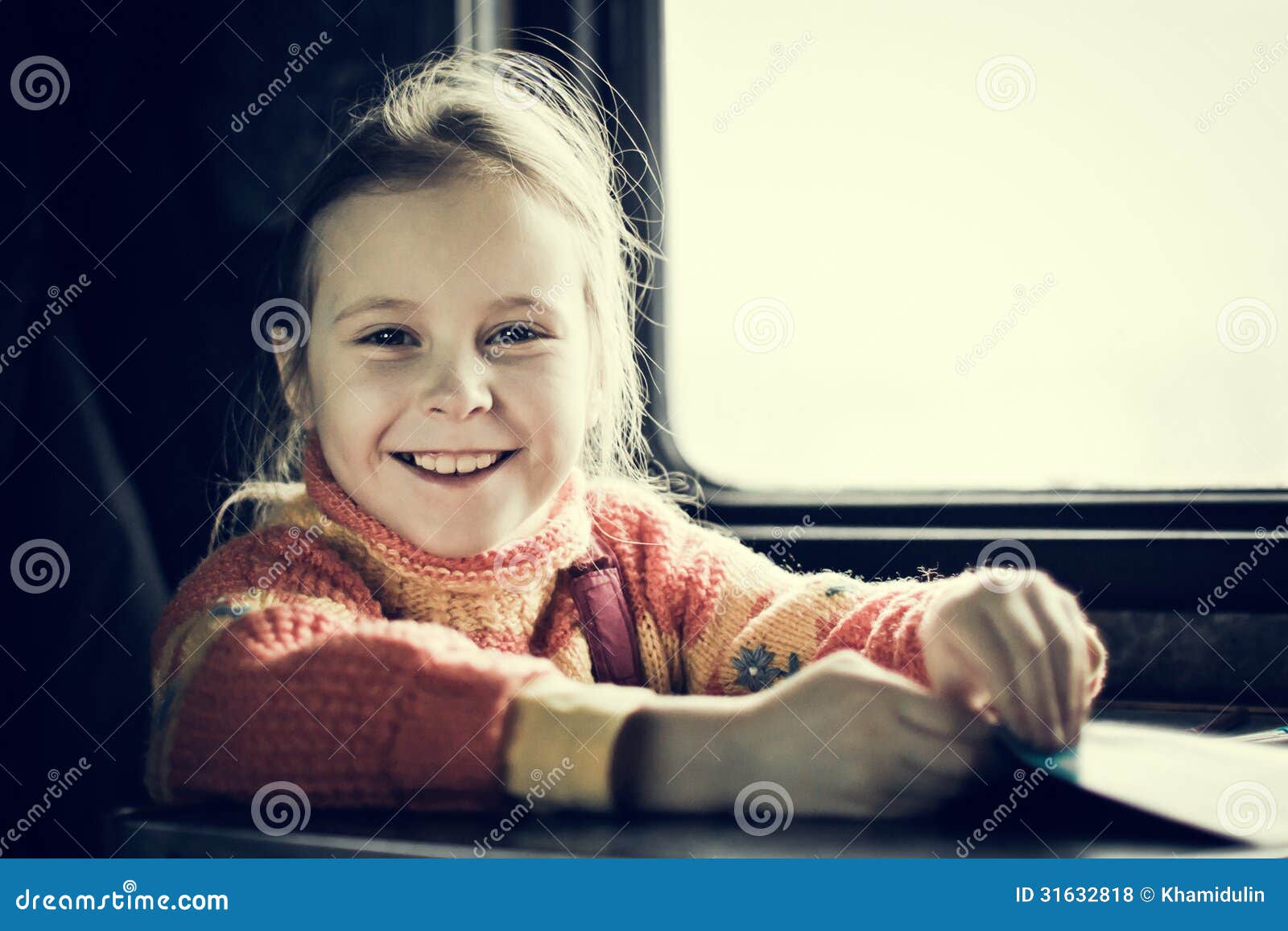 The girl sitting at a desk stock photo. Image of move - 31632818