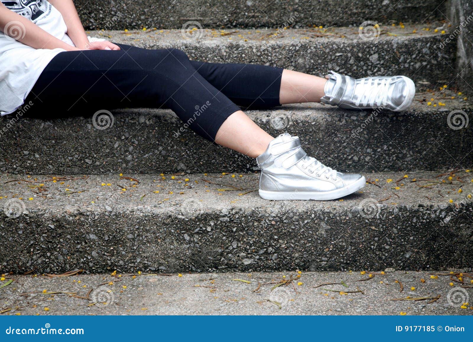 Girl sitting down on steps stock image. Image of feet - 9177185