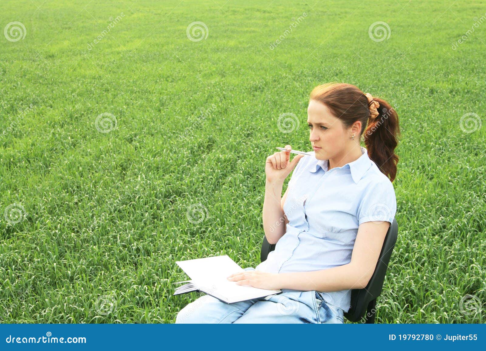Girl sitting in the field stock photo. Image of field - 19792780