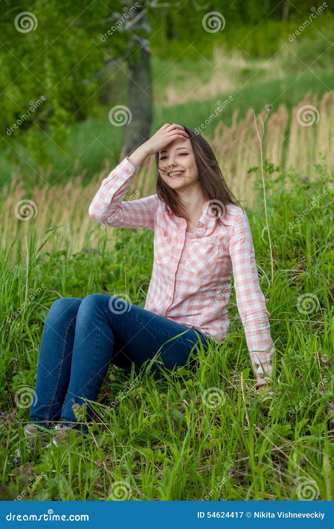 Girl sitting on the field stock image. Image of meadow - 54624417