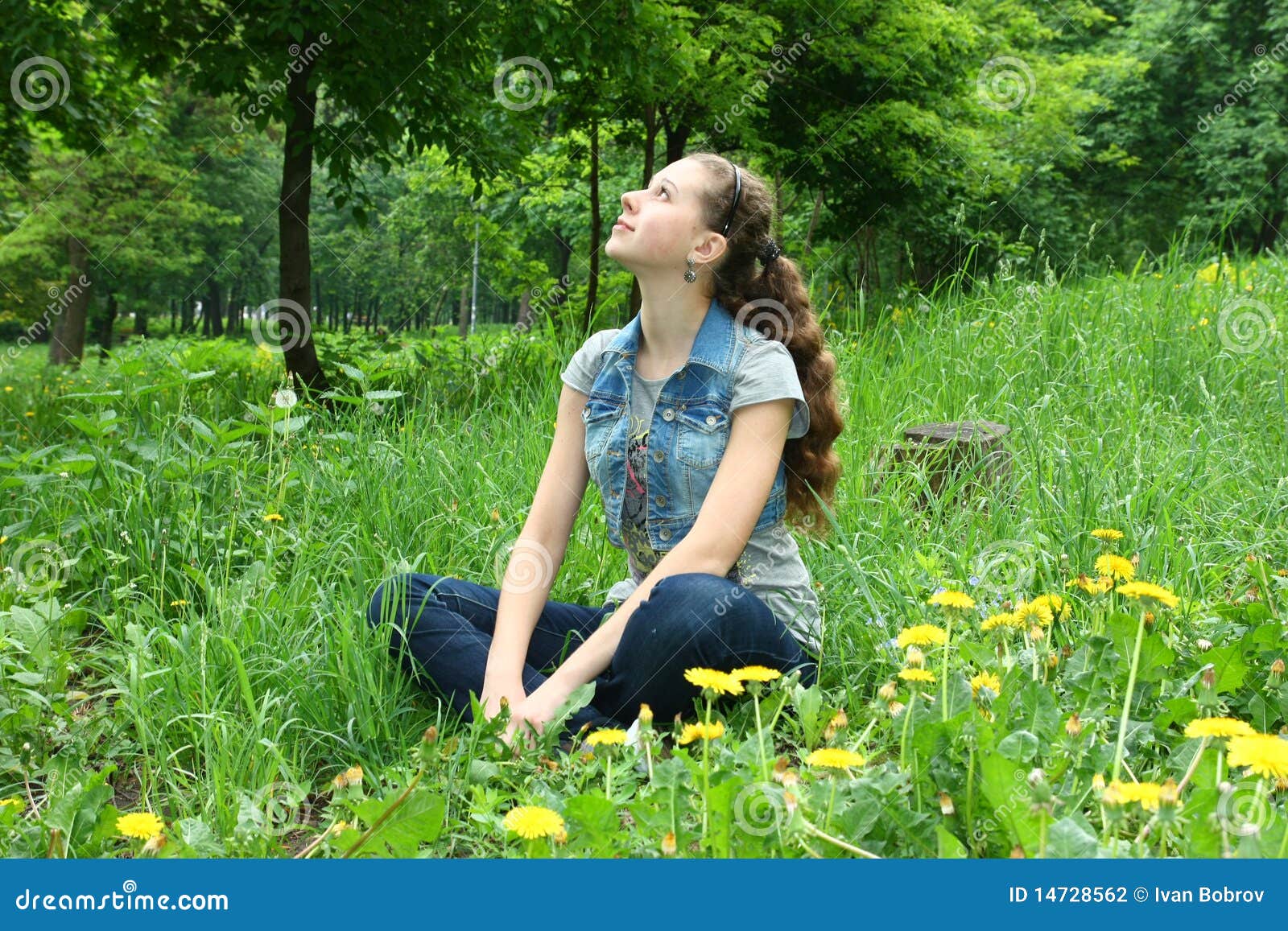 Girl sitting on the grass stock photo. Image of lines - 14728562