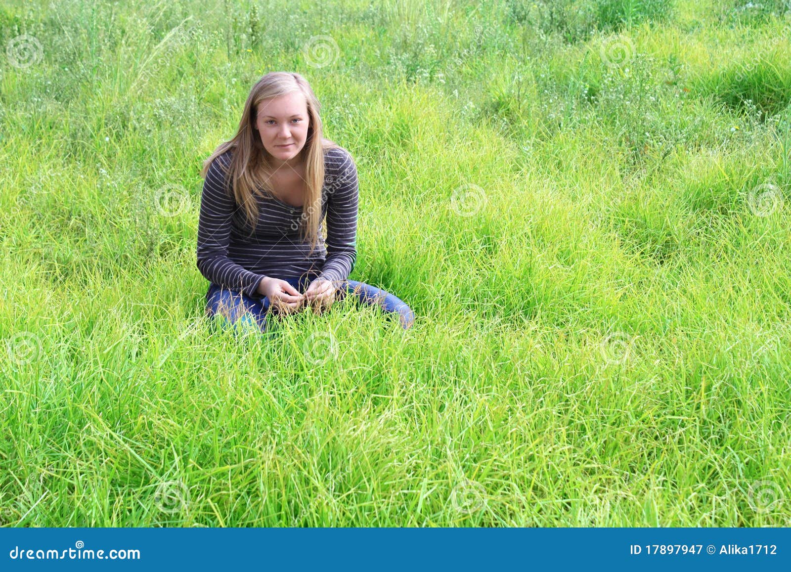 Girl sitting on the grass. stock image. Image of look - 17897947