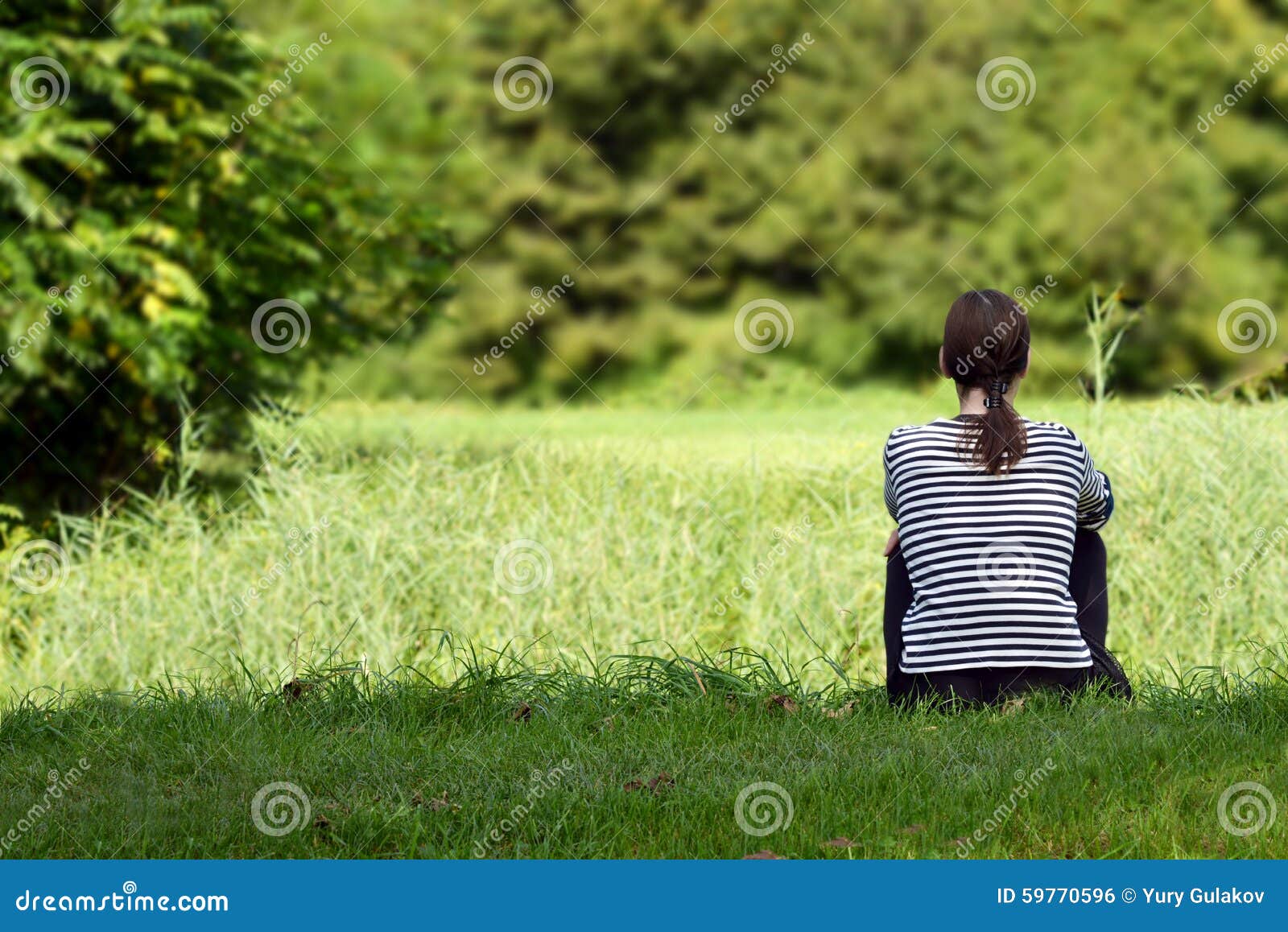 Girl Sitting on the Green Grass Stock Photo - Image of freedom, sitting ...