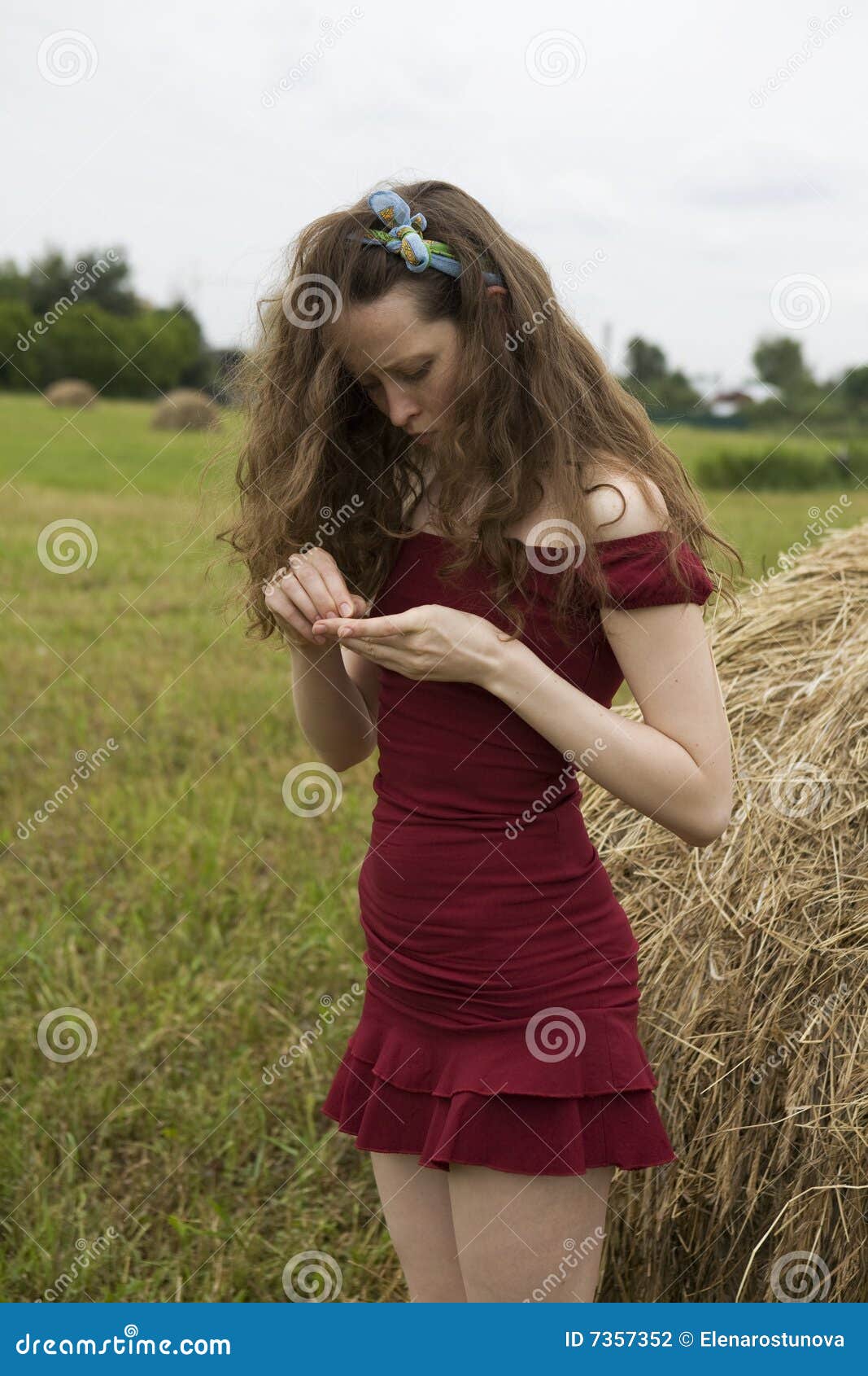 Girl Sitting on the Haystack Stock Photo - Image of cloud, haystack ...