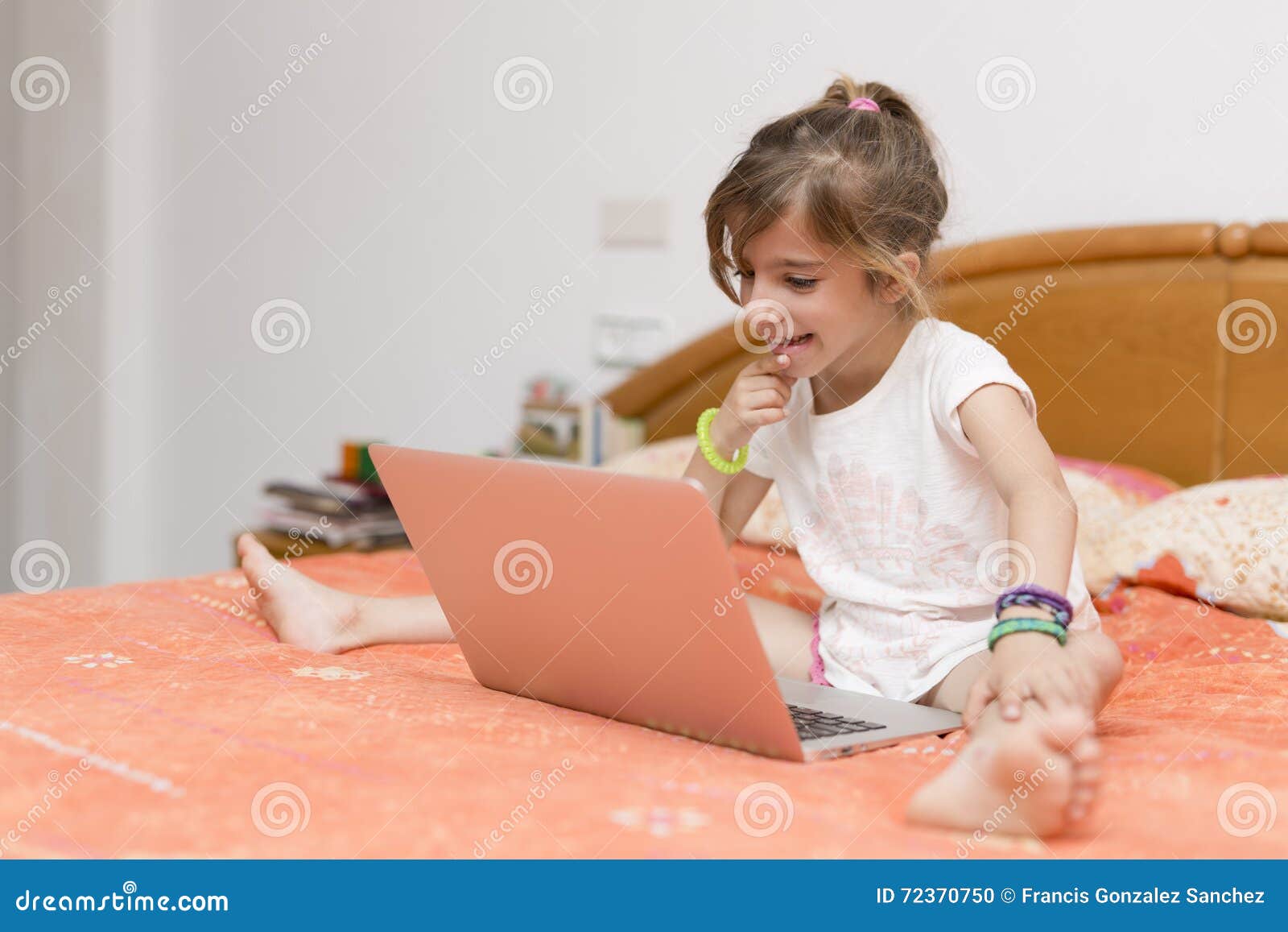 Girl sitting with a laptop stock photo. Image of child - 72370750