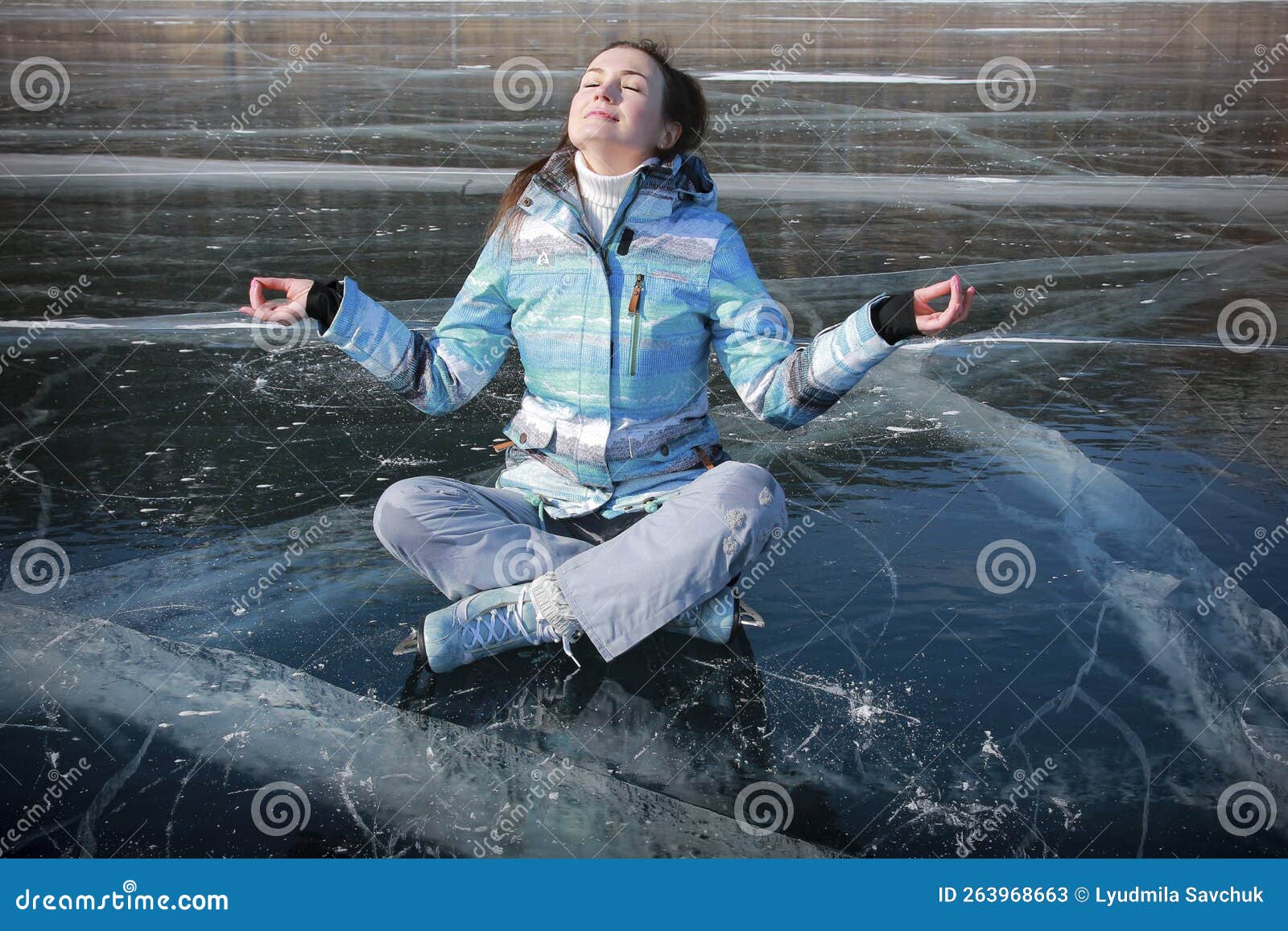 The Girl is Sitting and Meditating on the Ice Stock Image - Image of ...