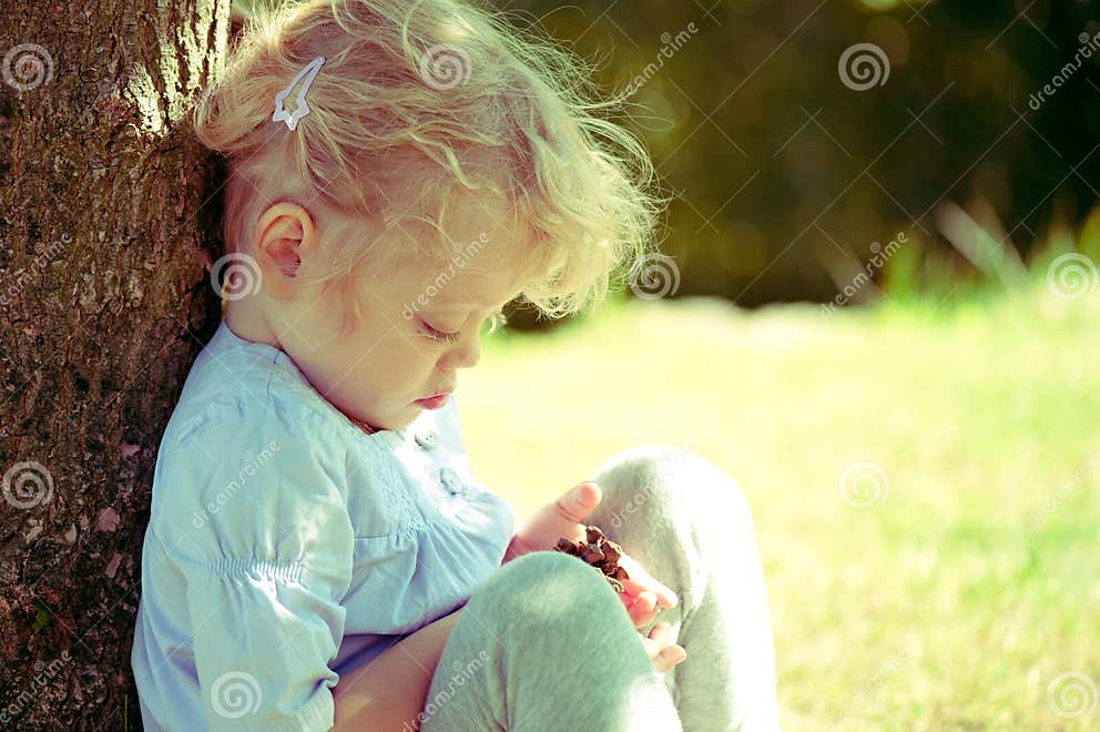 Girl Sitting Next To the Tree Stock Photo - Image of sunny, outing ...