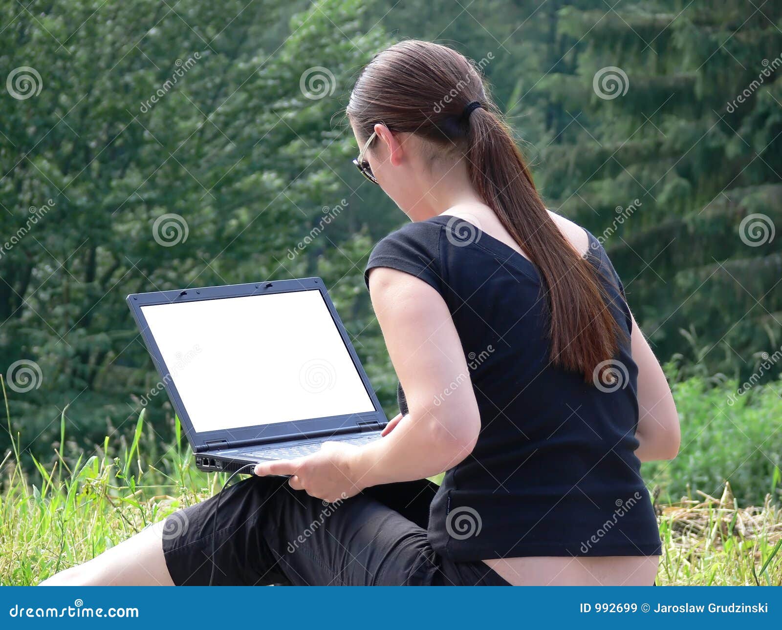 A Girl Sitting Outside With A Laptop Royalty Free Stock Images - Image ...