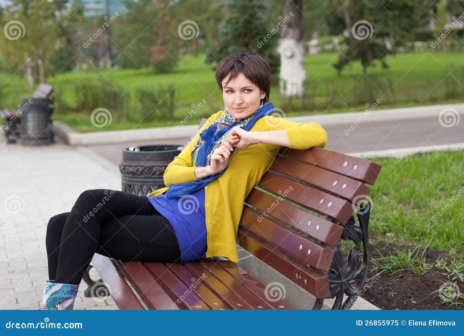 The Girl is Sitting on a Park Bench Stock Image - Image of appealing ...