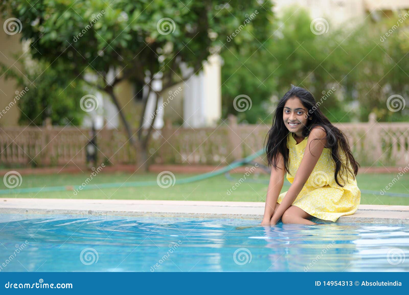 Girl sitting at pool stock image. Image of summer, traditionally - 14954313