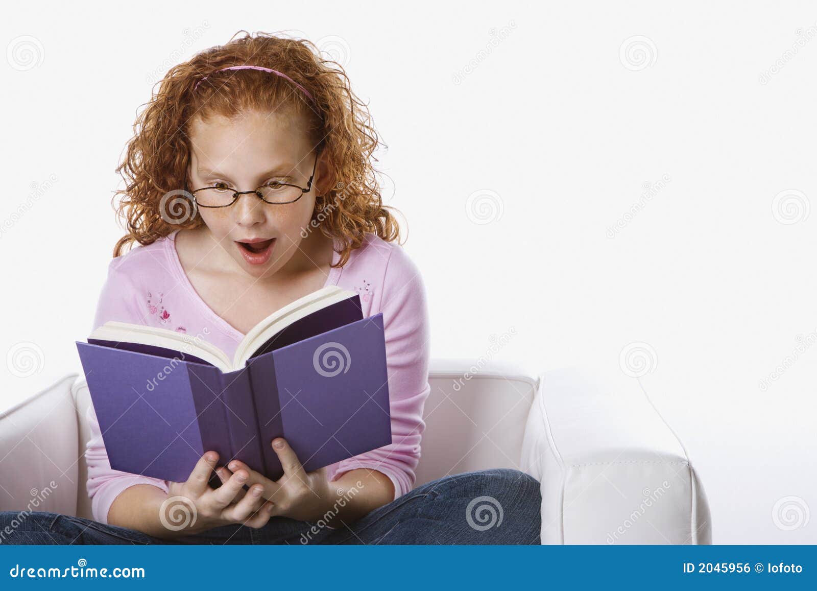 Girl sitting reading book stock photo. Image of eyeglass - 2045956