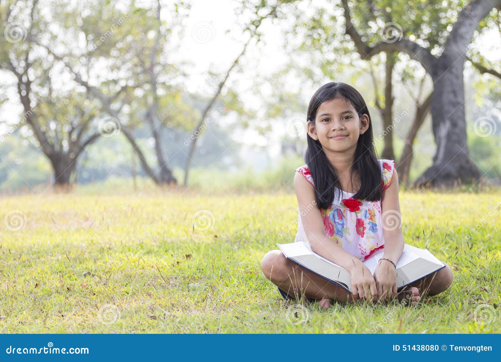Girl Sitting Reading a Book. Stock Photo - Image of light, books: 51438080