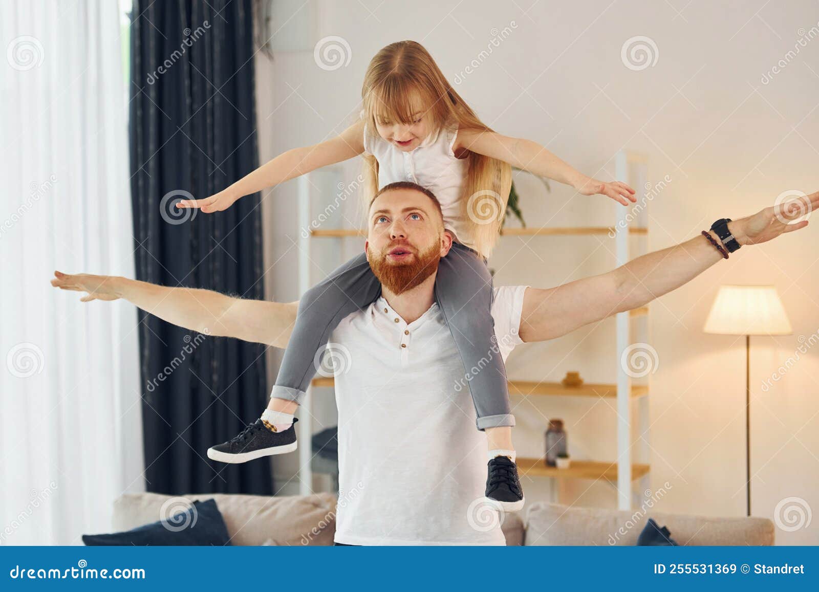 Girl Sitting on the Shoulders. Father with His Little Daughter is at ... Girl Sitting on the Shoulders. Father with His Little Daughter is at ...