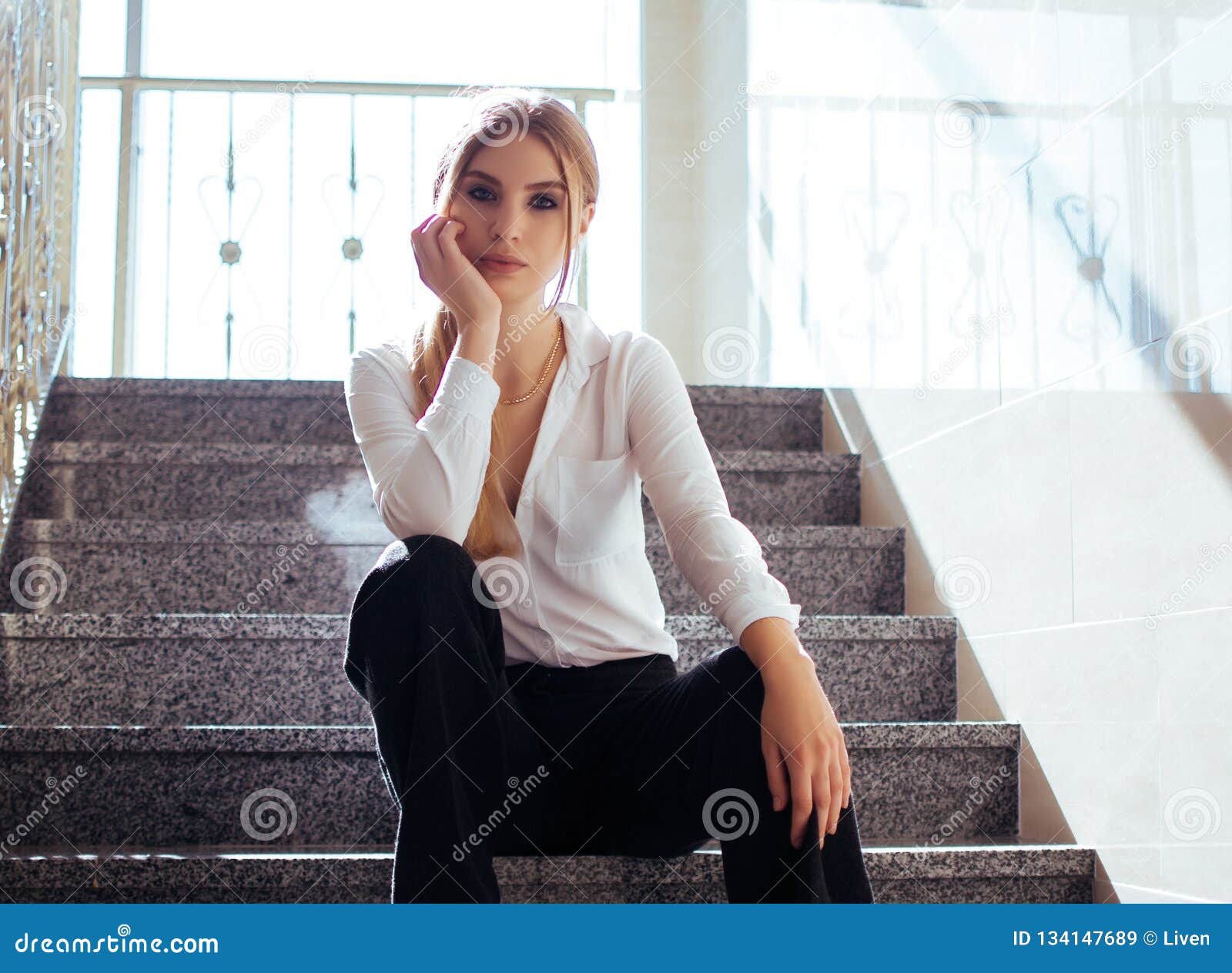 Girl sitting on the stairs stock image. Image of fashion - 134147689