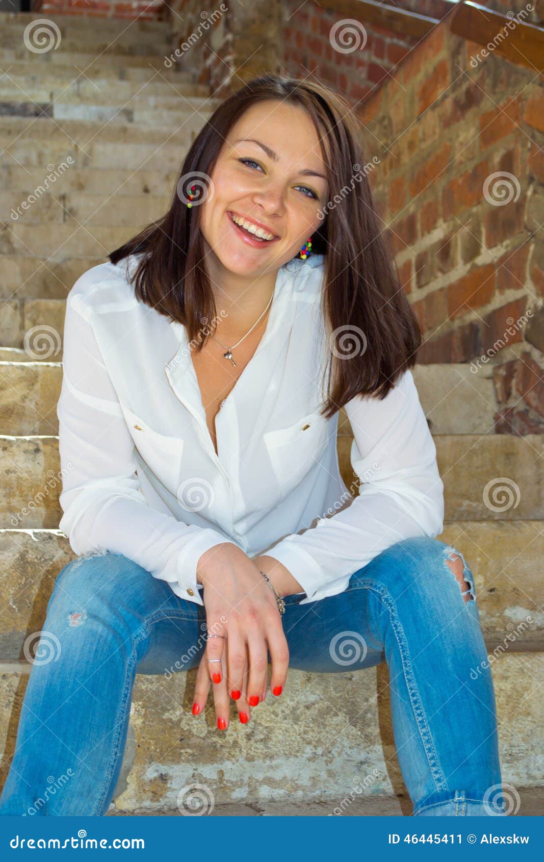 Girl sitting on stairs stock image. Image of brunette - 46445411
