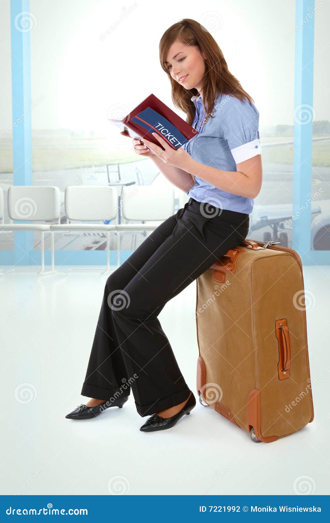 Girl sitting on a suitcase stock photo. Image of casual - 7221992