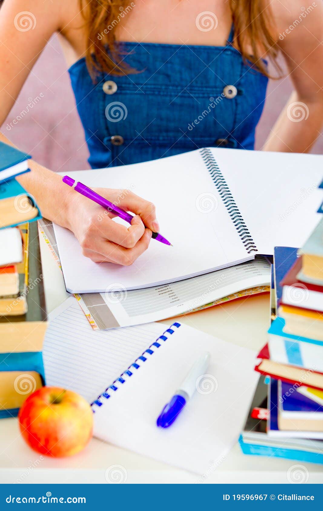 Girl Sitting at Table and Doing Homework. Closeup Stock Image - Image ...